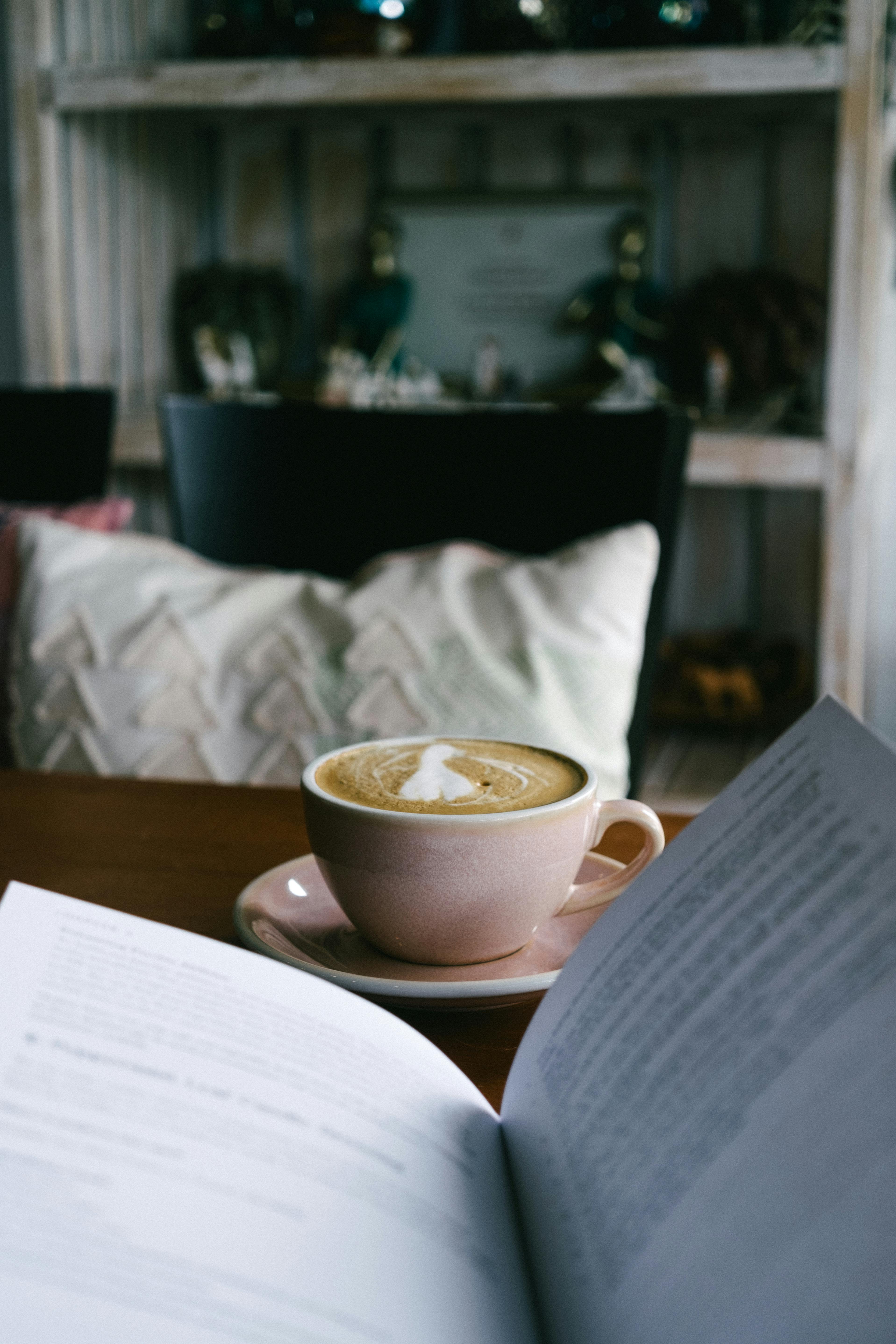 An Open Book and a Cup of Coffee · Free Stock Photo
