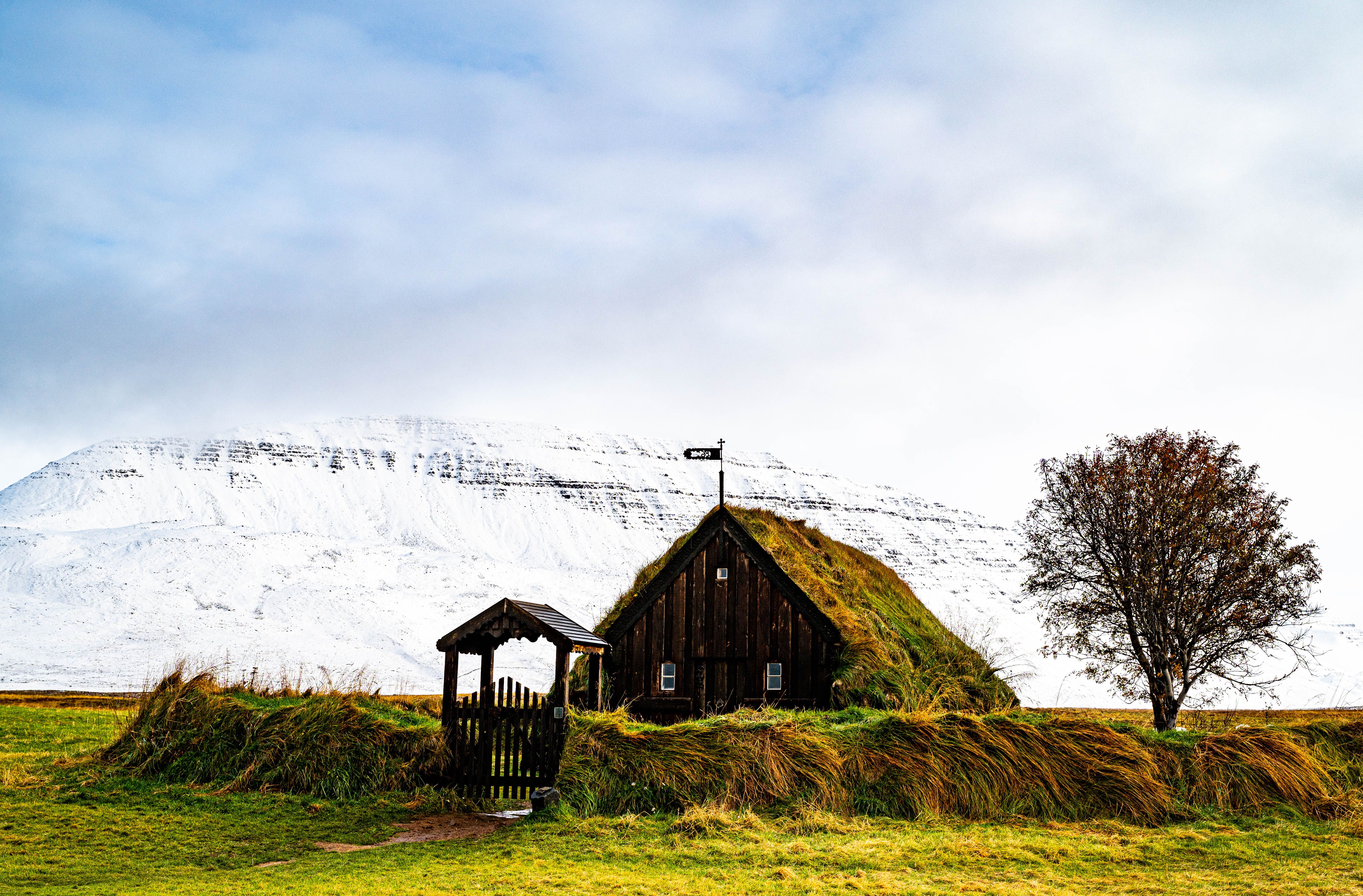 Wooden House near Hill in Snow in Iceland · Free Stock Photo