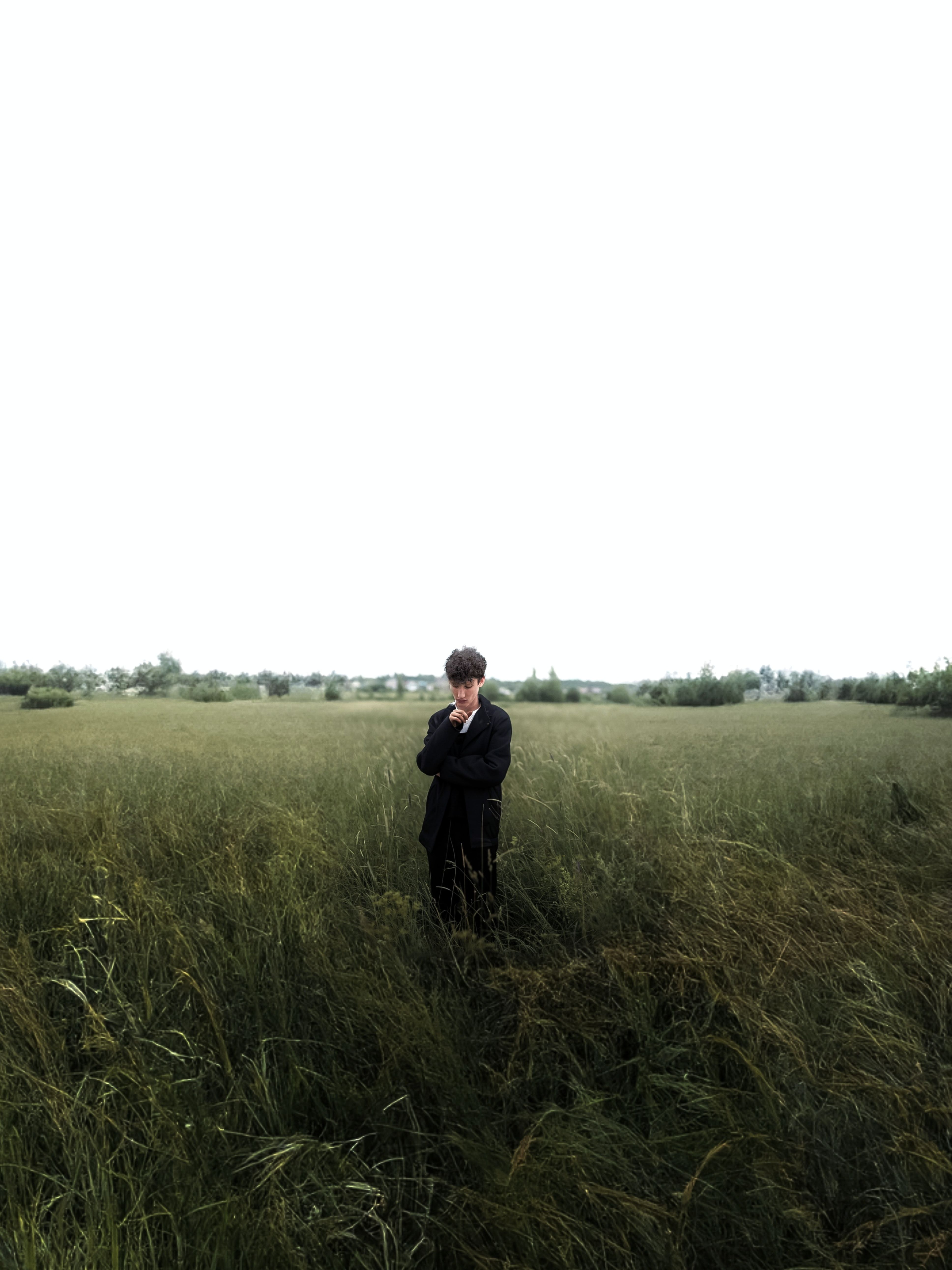 Elegant Man Smoking a Cigarette on a Field · Free Stock Photo