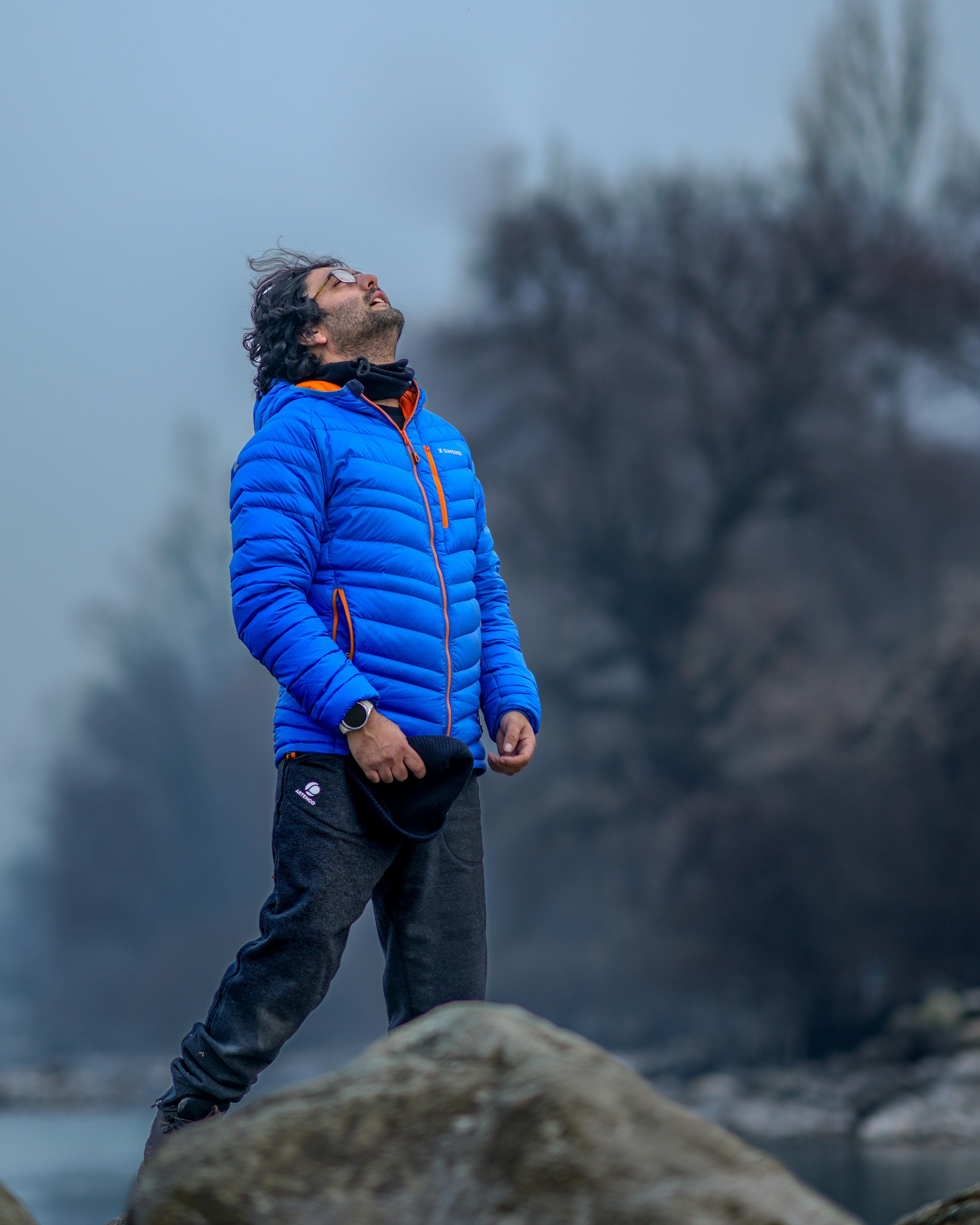 Man Wearing Blue Jacket in a Valley · Free Stock Photo