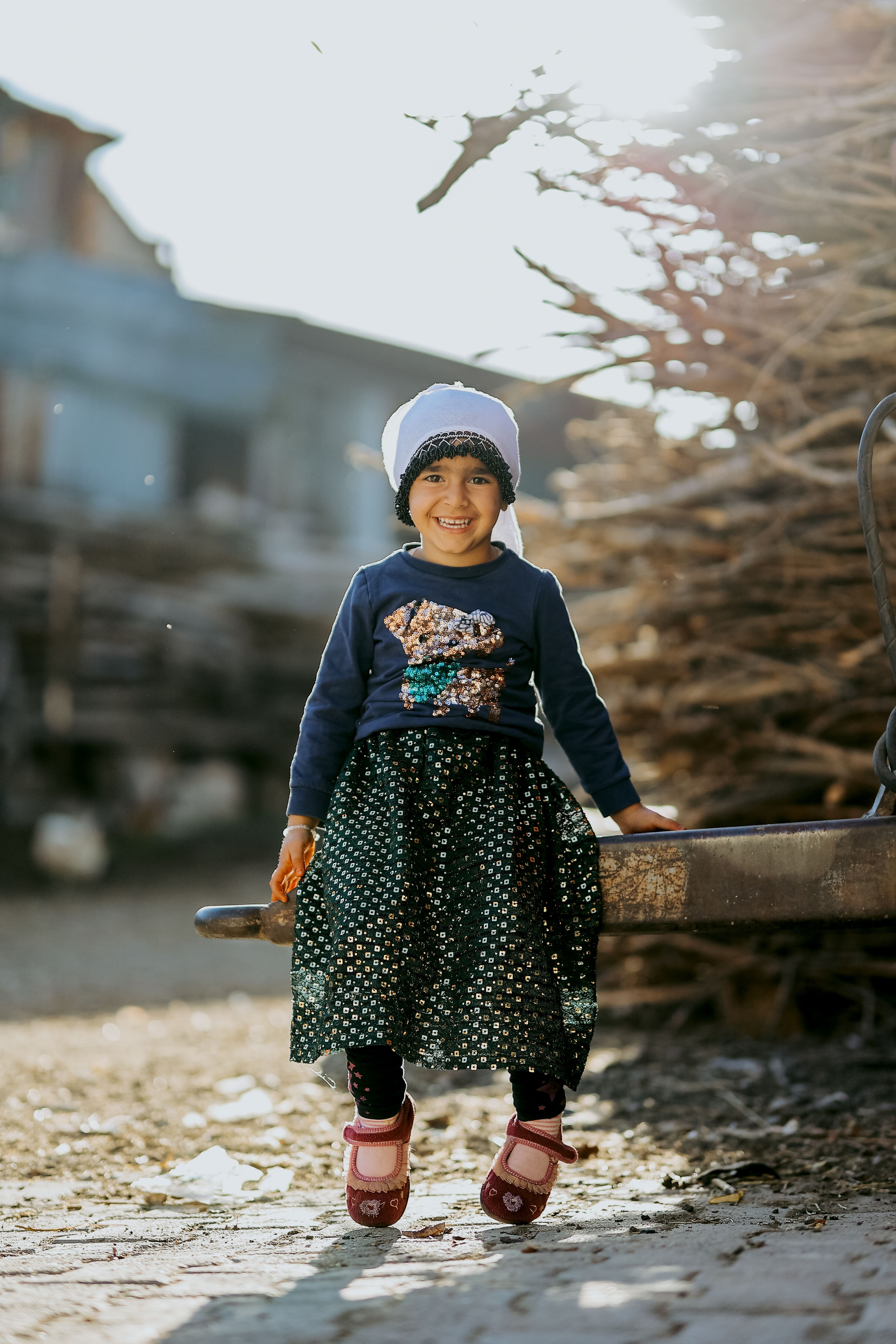 Smiling Girl in Skirt and Shawl in Village · Free Stock Photo