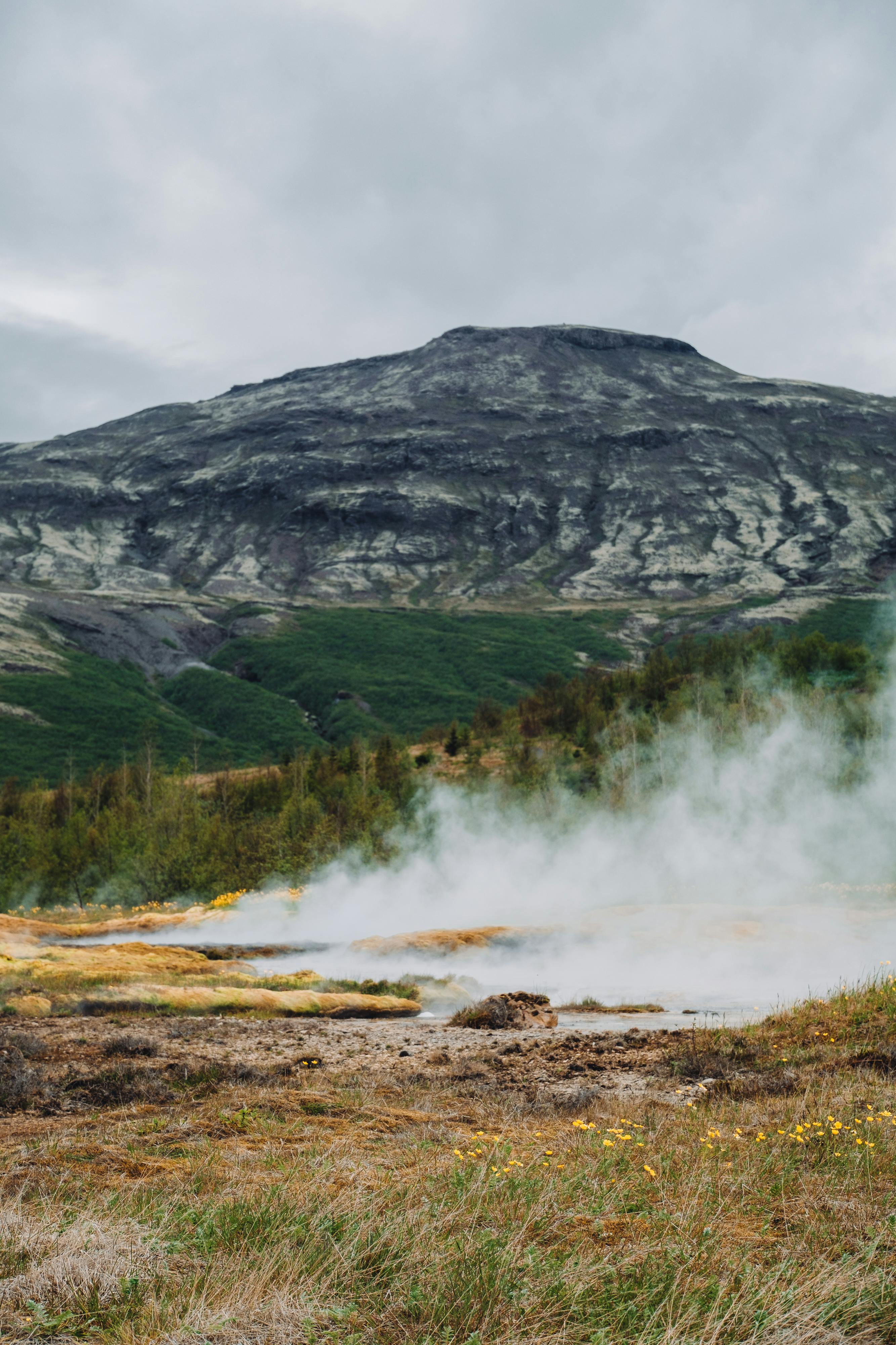 Landscape Photography of Land Field and Body of Water · Free Stock Photo