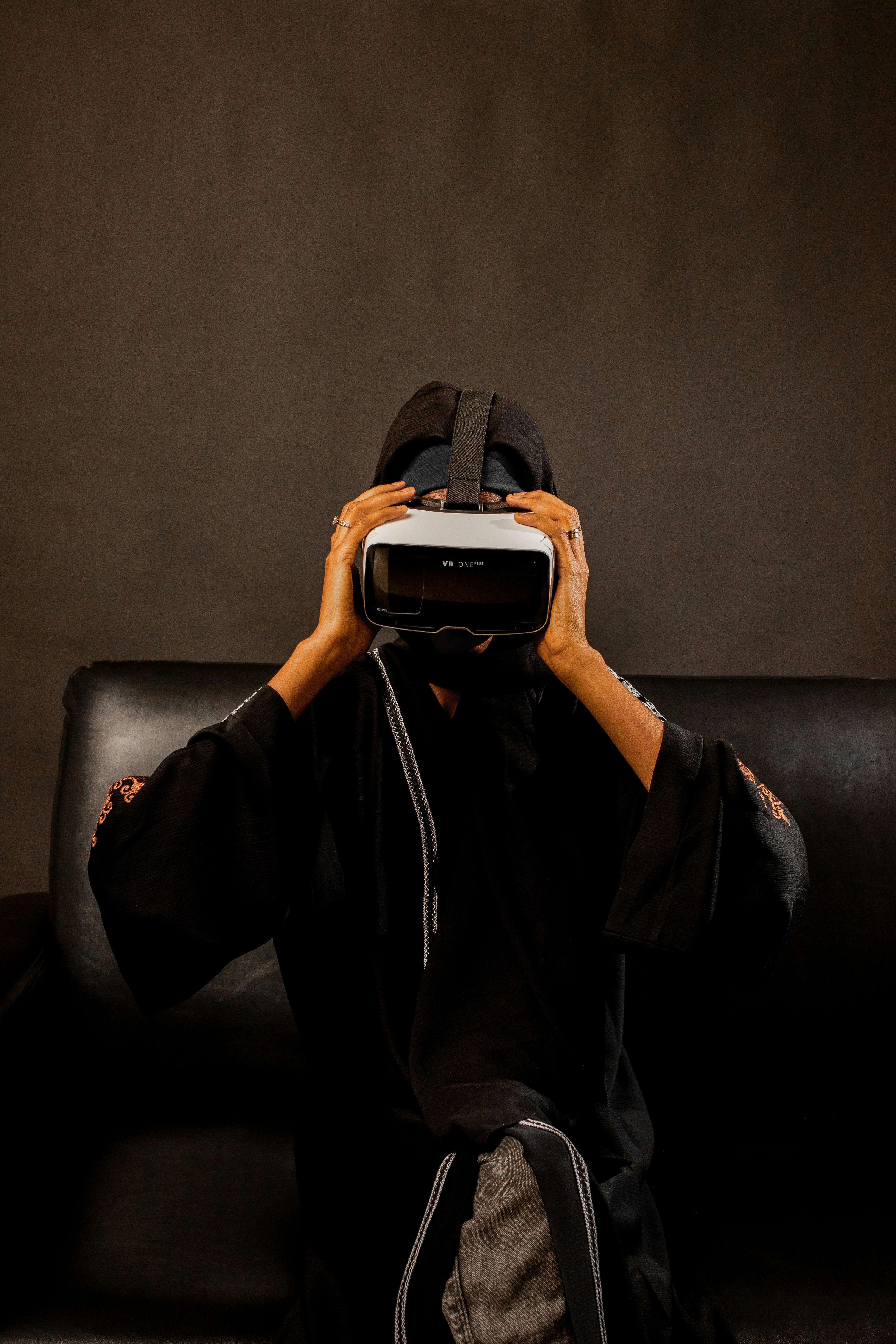 Woman in Traditional Clothing Sitting and Wearing a VR Headset · Free ...