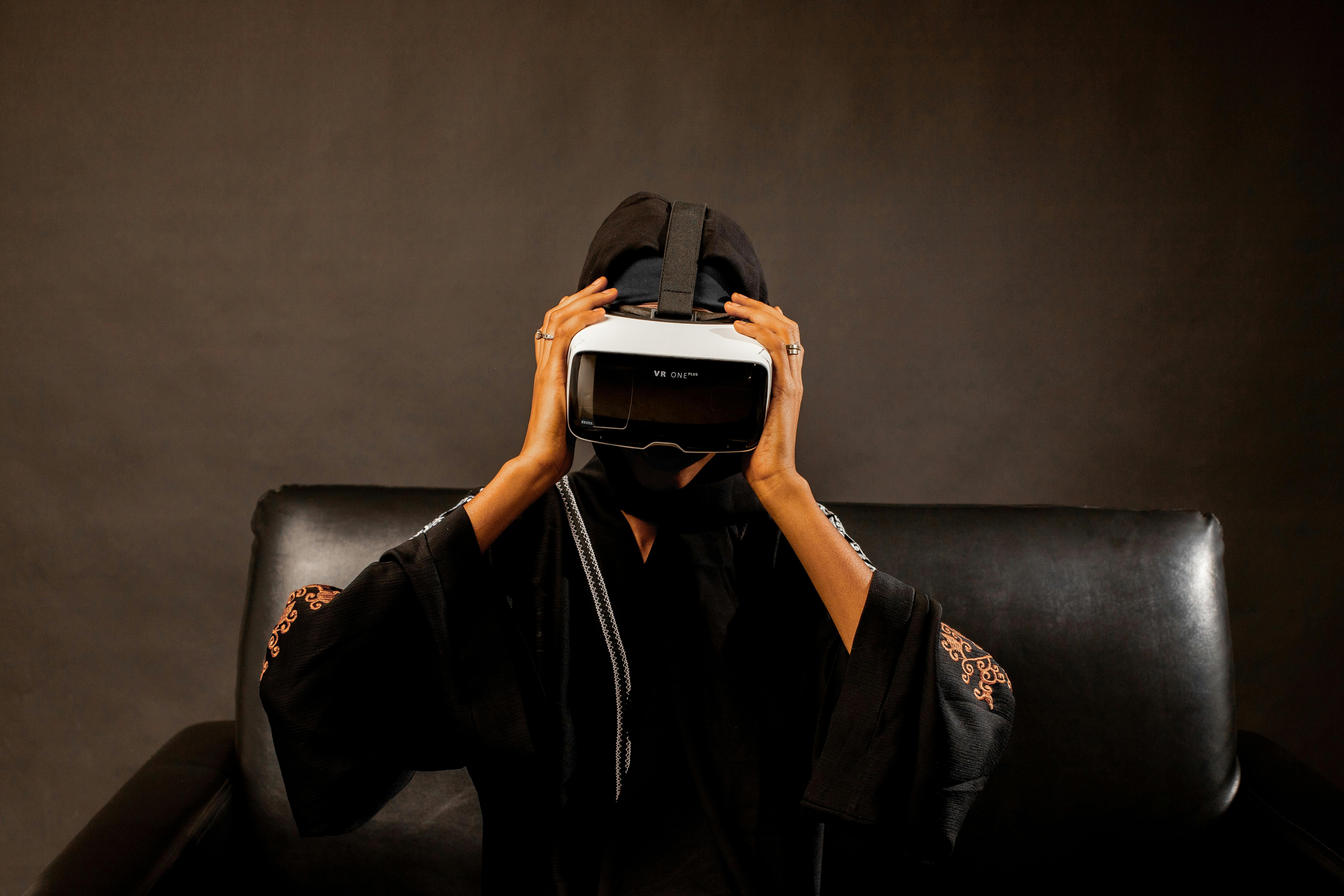 Woman in Traditional Clothing Sitting and Wearing a VR Headset · Free ...