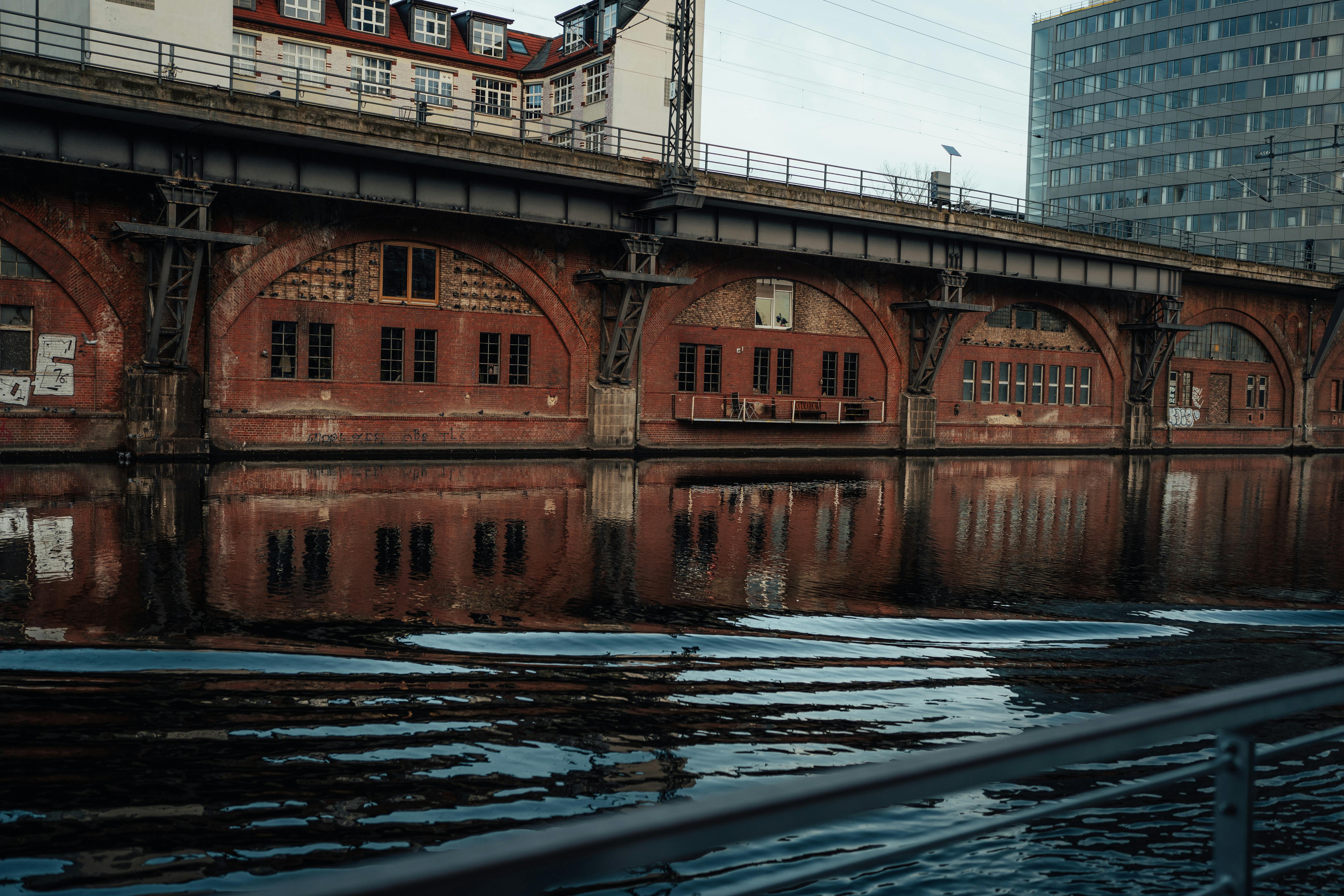 View of Old Waterfront Buildings long a River in City · Free Stock Photo