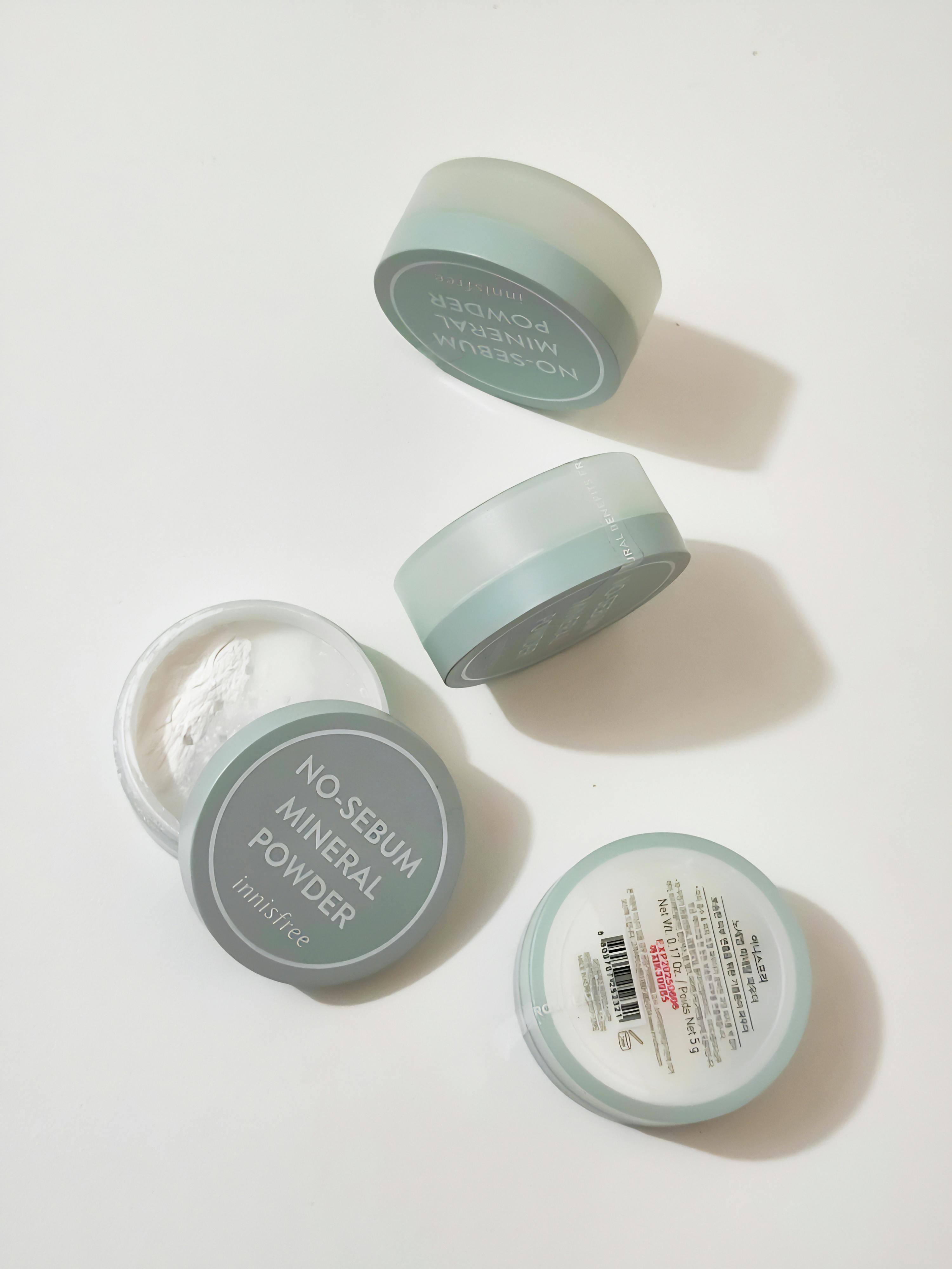 Pressed Powders on White and Beige Surfaces · Free Stock Photo