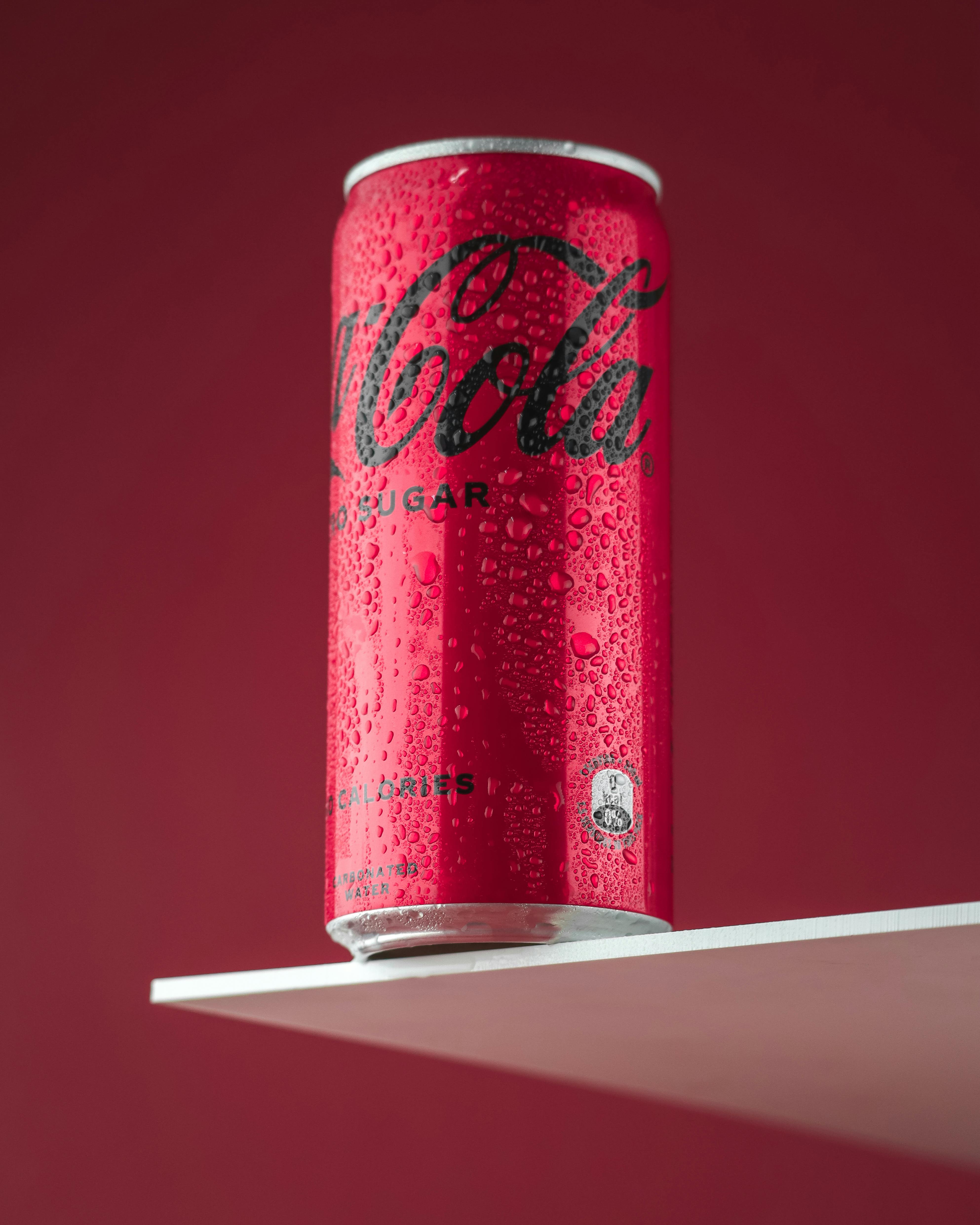 Coca Cola Can on Black Surface · Free Stock Photo