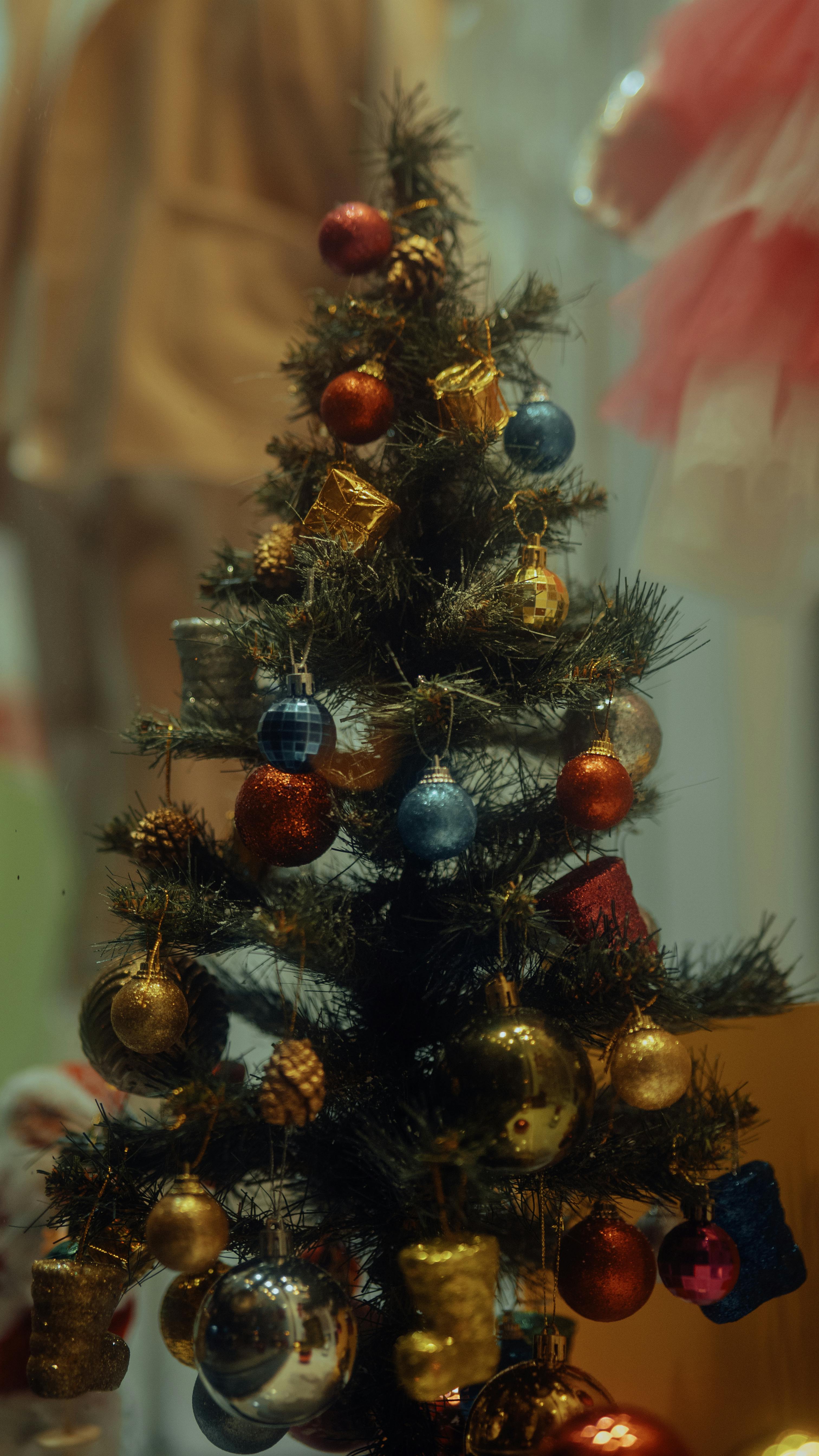 Close-up of Ornaments and Lights on a Christmas Tree · Free Stock Photo