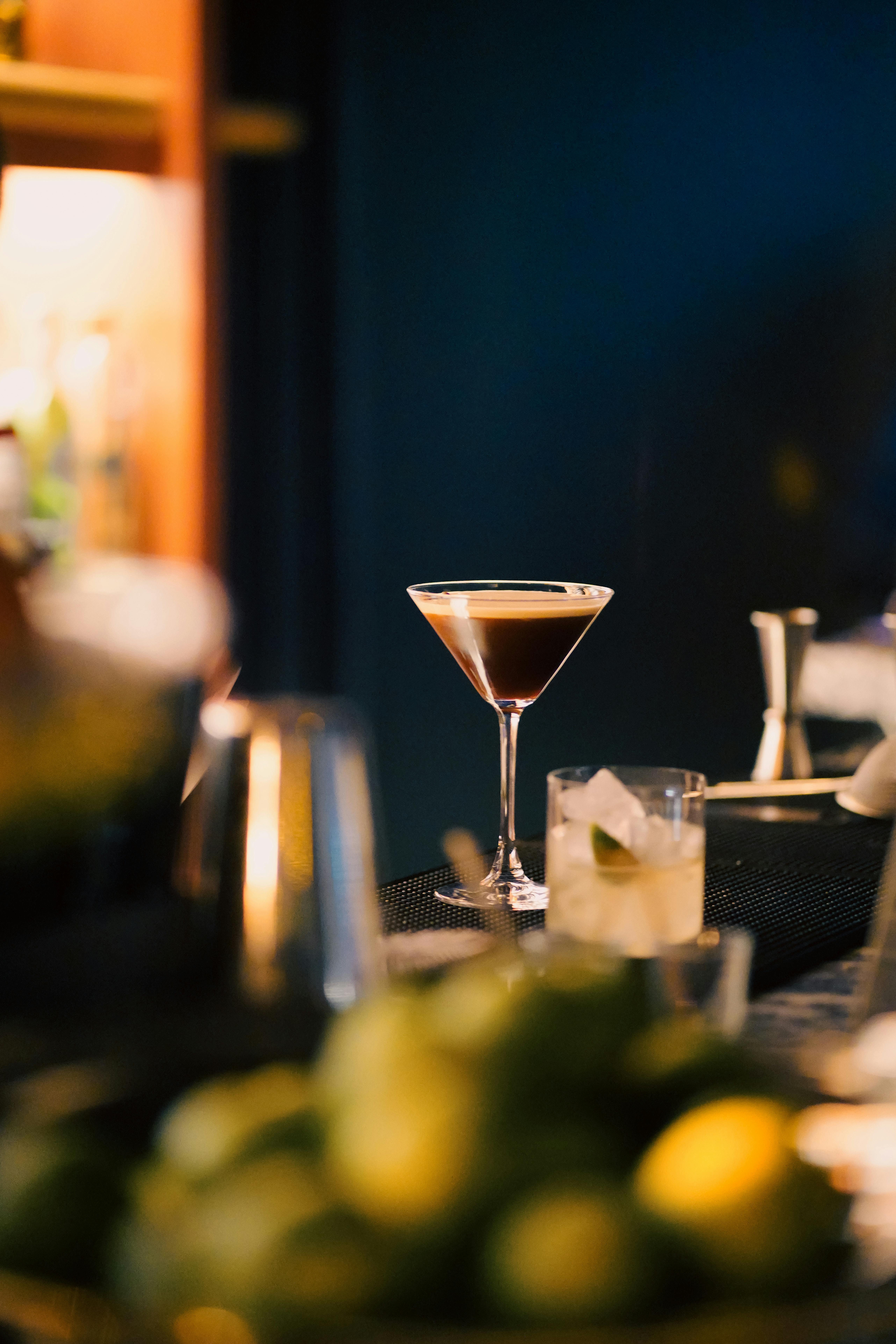 Cocktails Standing on a Bar Counter · Free Stock Photo