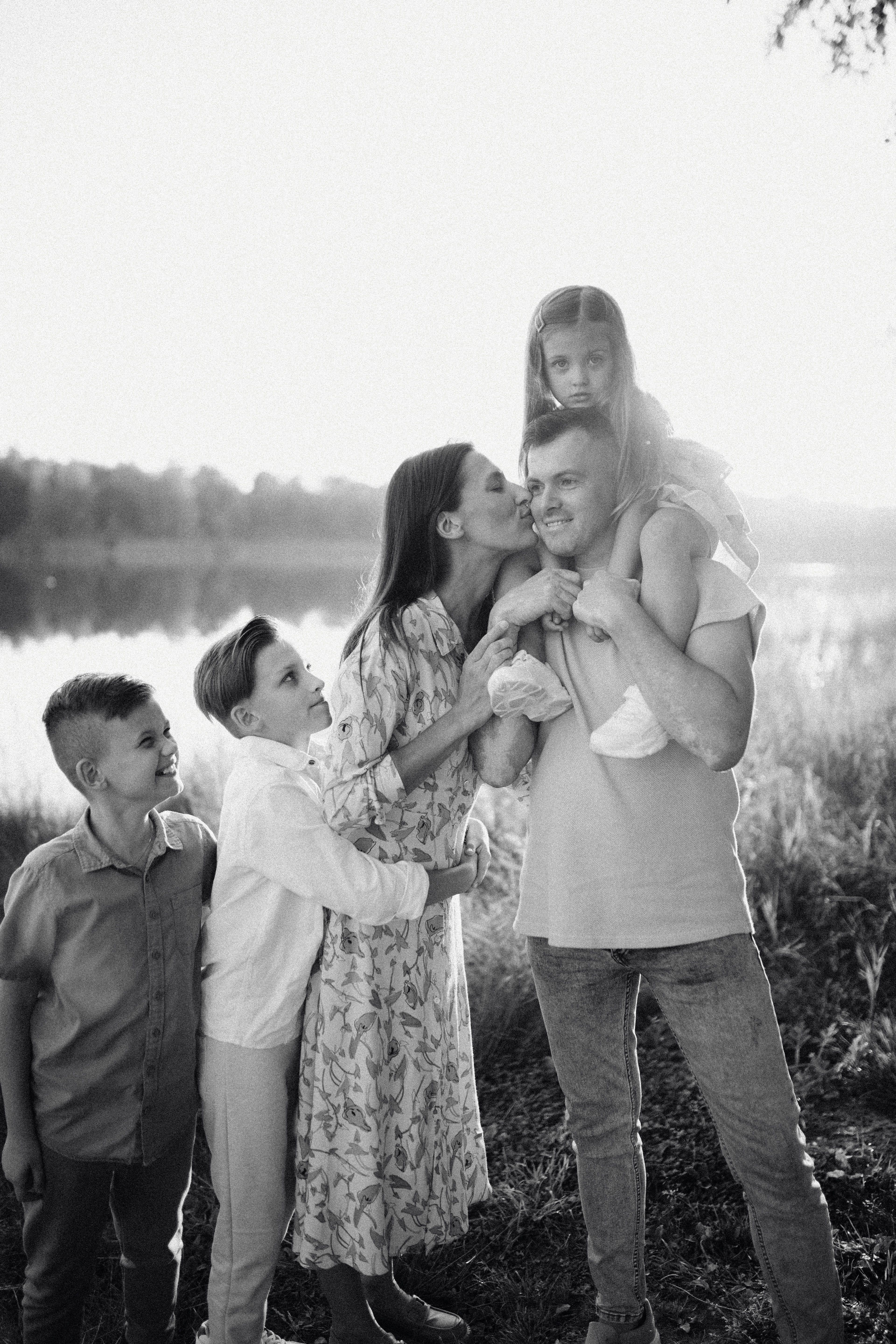 A family is posing for a black and white photo · Free Stock Photo