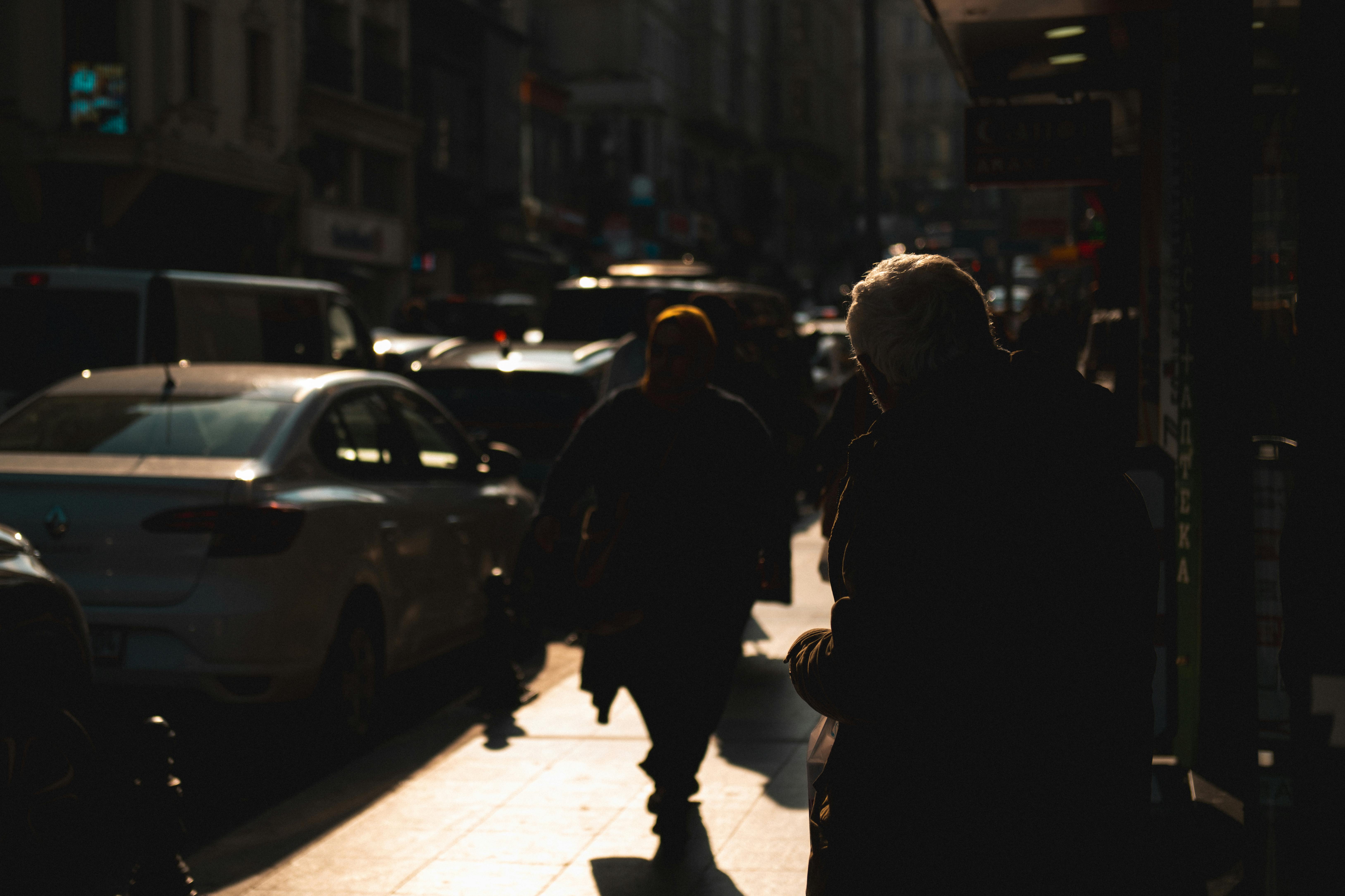 Old Man on Busy City Street on Sunset · Free Stock Photo
