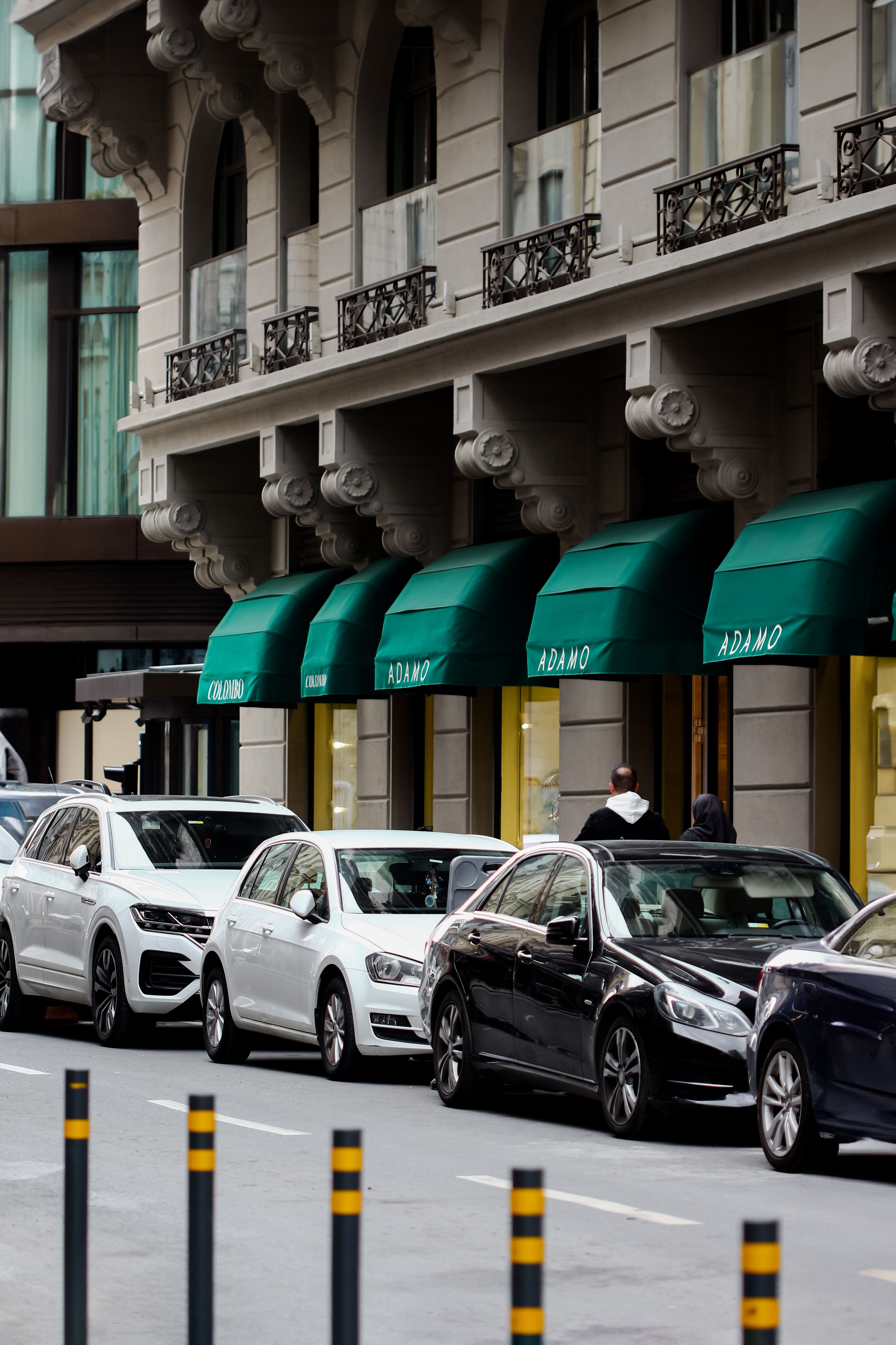 Cars Parked in Front of the Adamo Store · Free Stock Photo