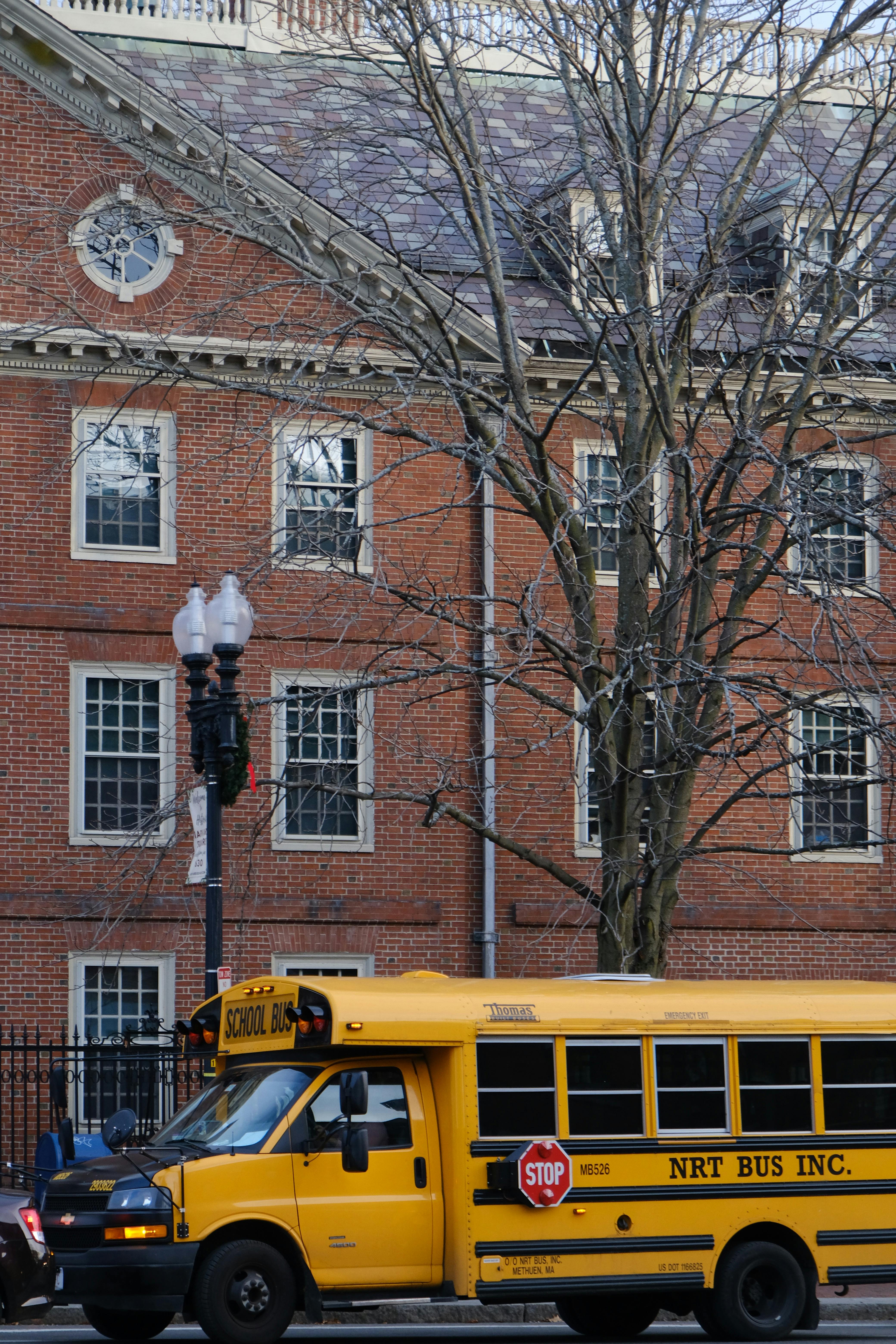 School Bus Next to Harvard University Strauss Hall Building · Free ...