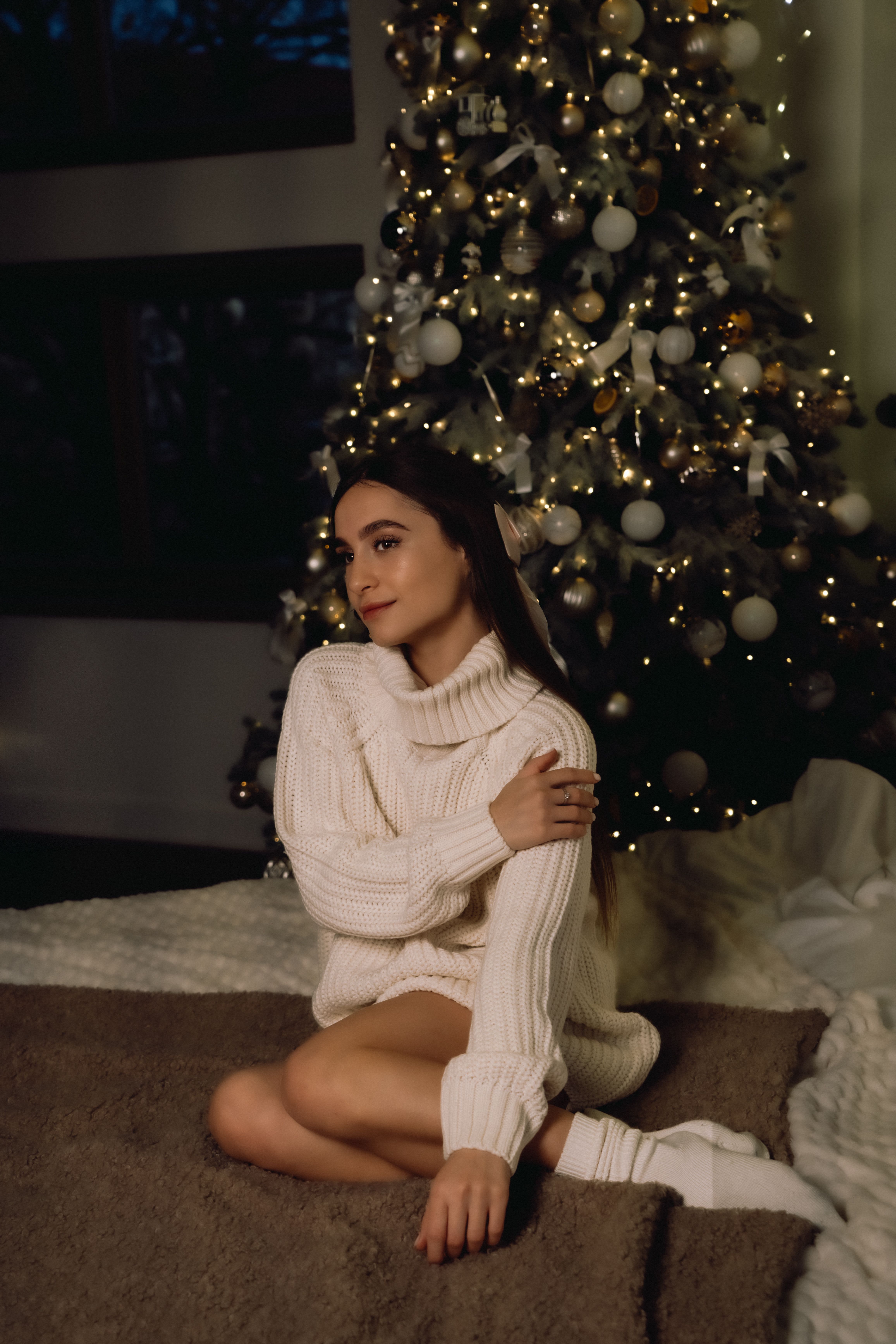 Woman Relaxing near Christmas Tree · Free Stock Photo