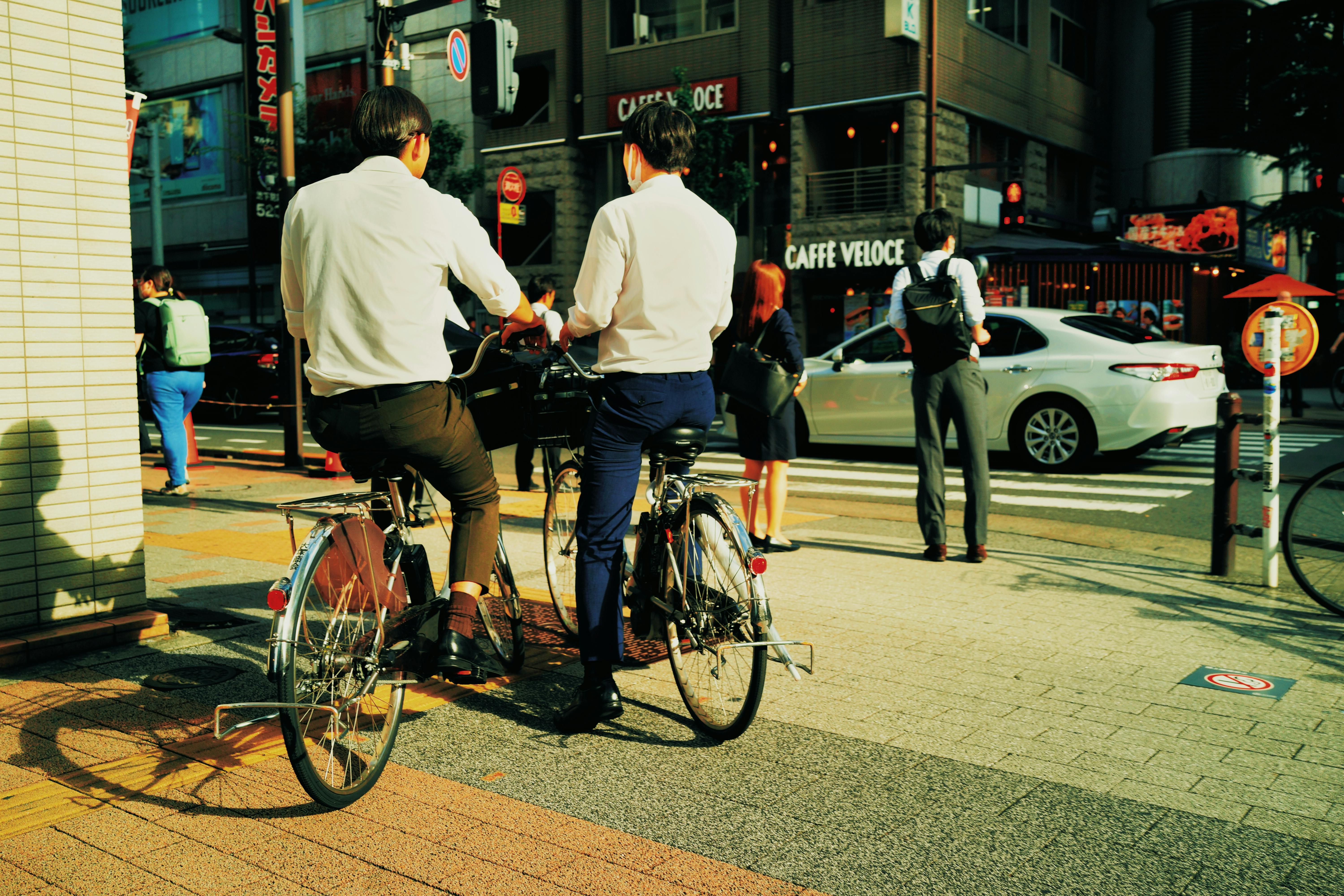 Two Men on Bicycles in a City · Free Stock Photo