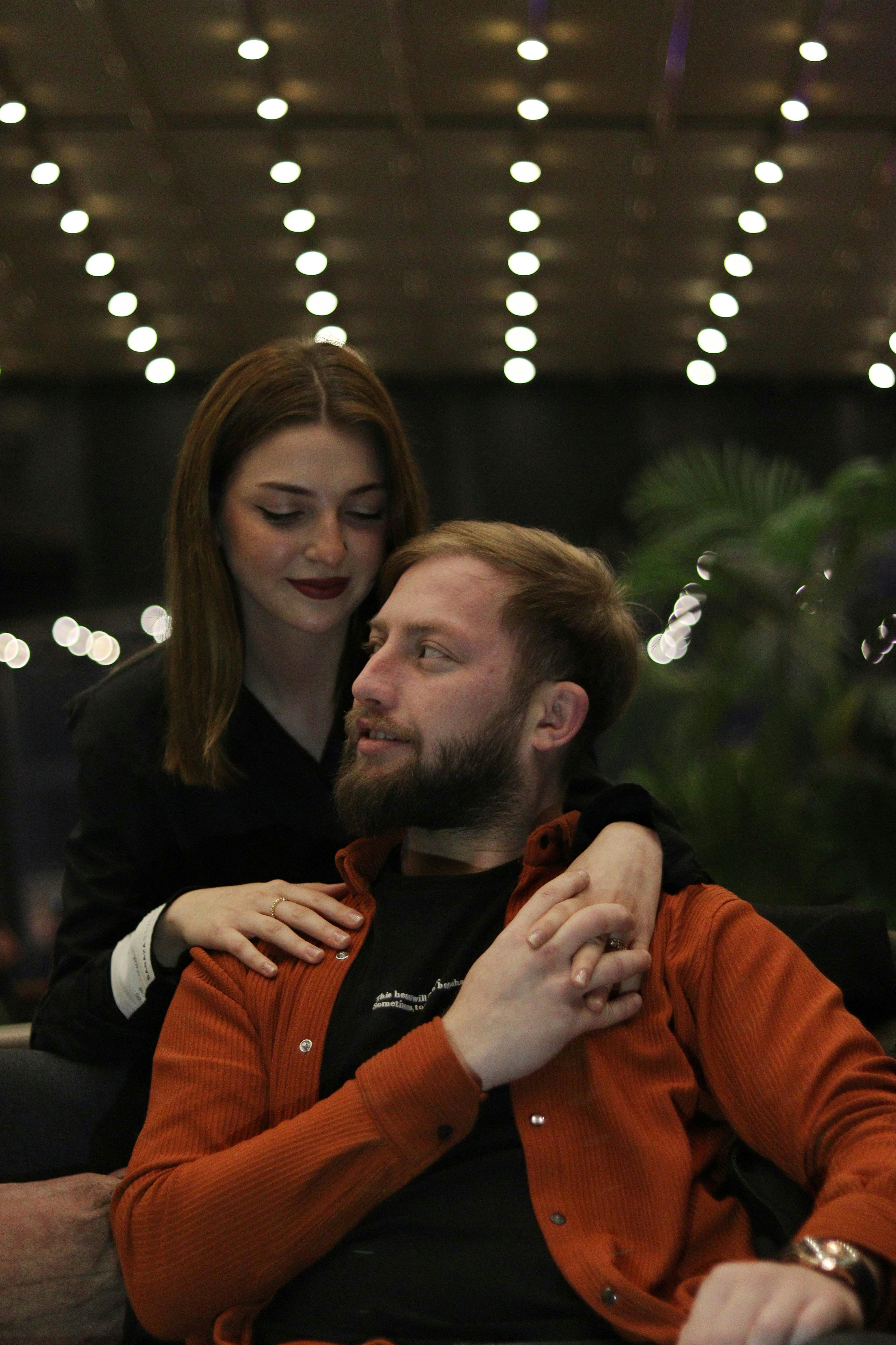 Woman Standing behind Man and Embracing · Free Stock Photo