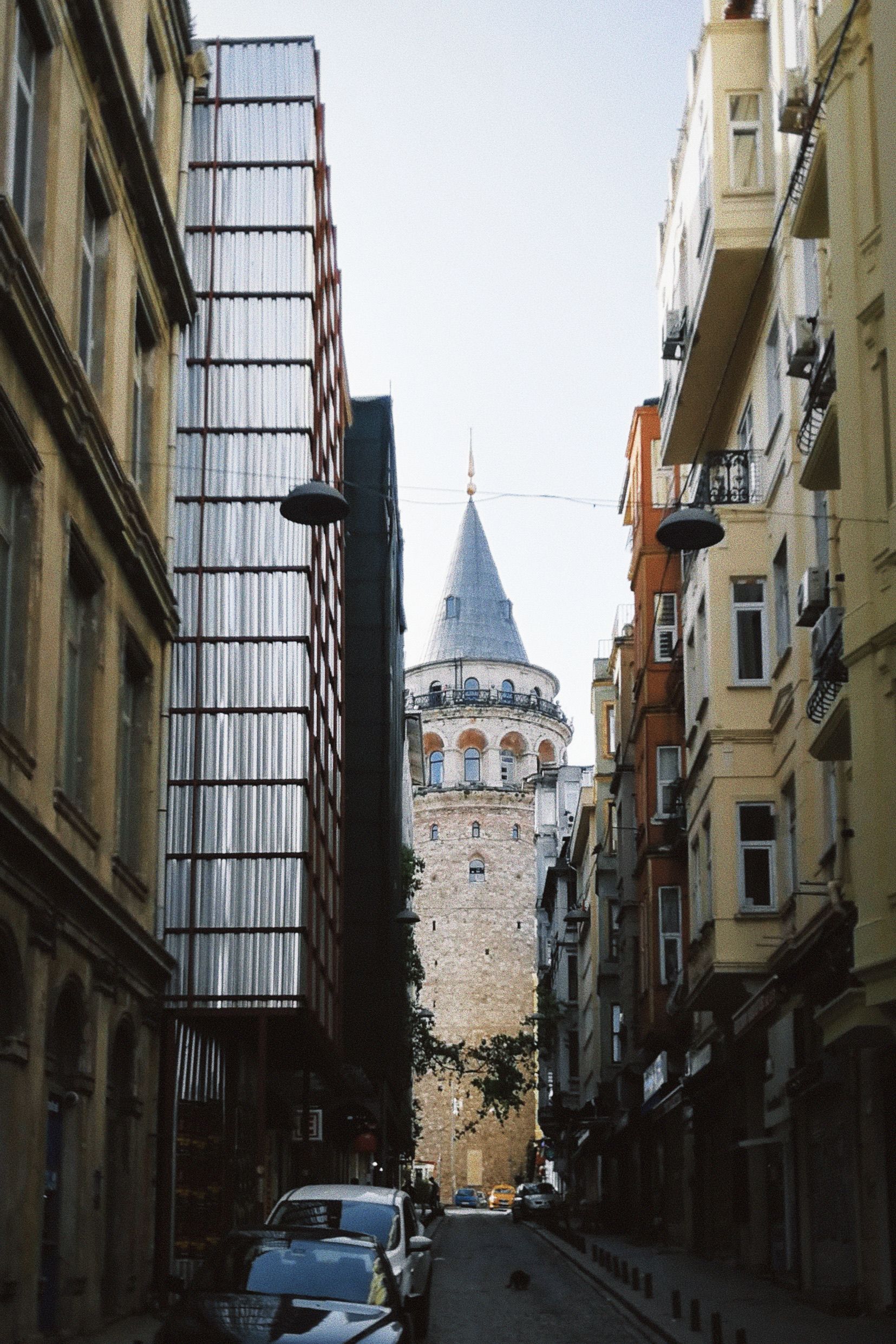 Narrow City Street with a Tower in Perspective · Free Stock Photo