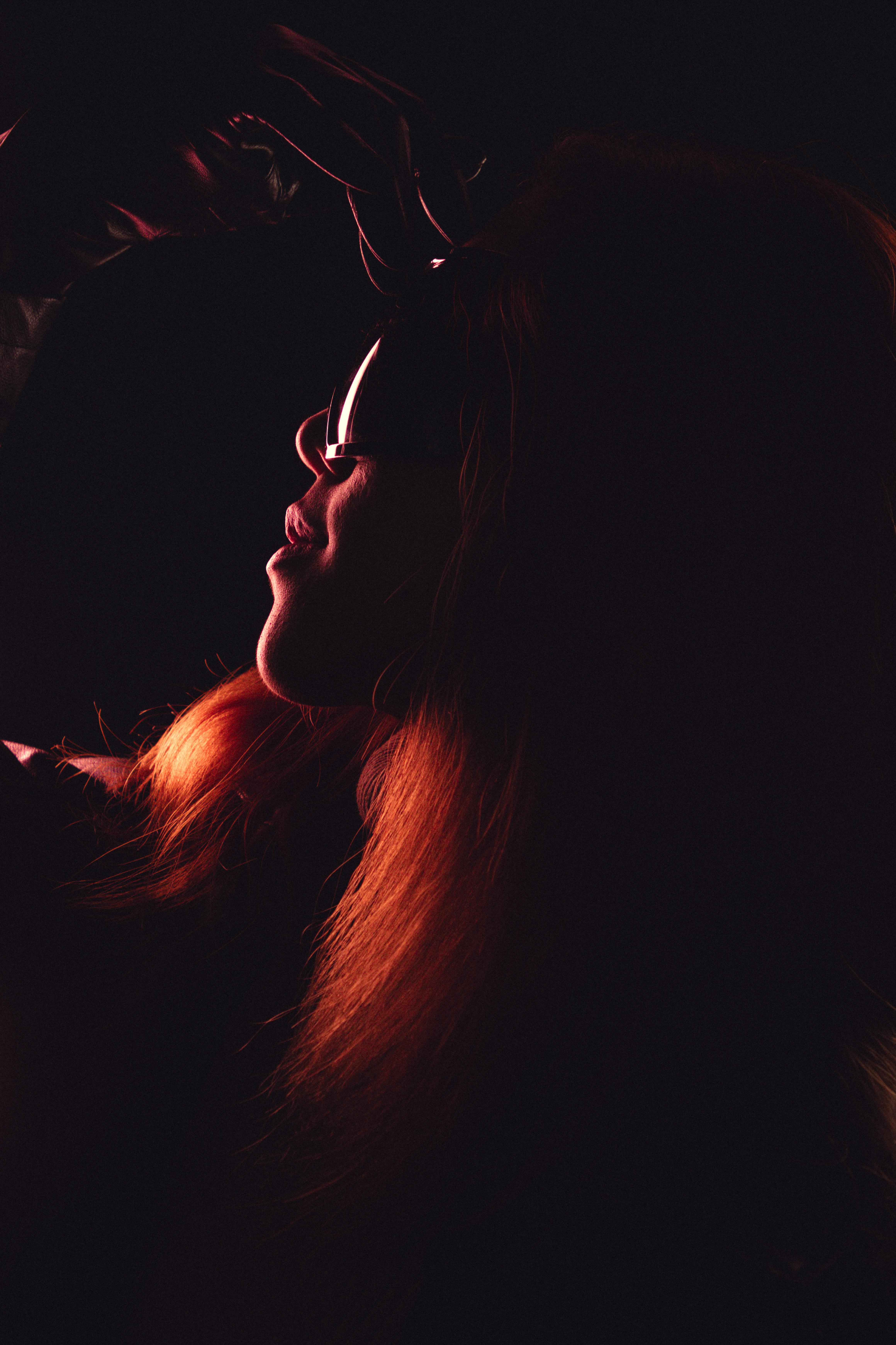 Dark Side Shot of a Woman Wearing Goggles · Free Stock Photo