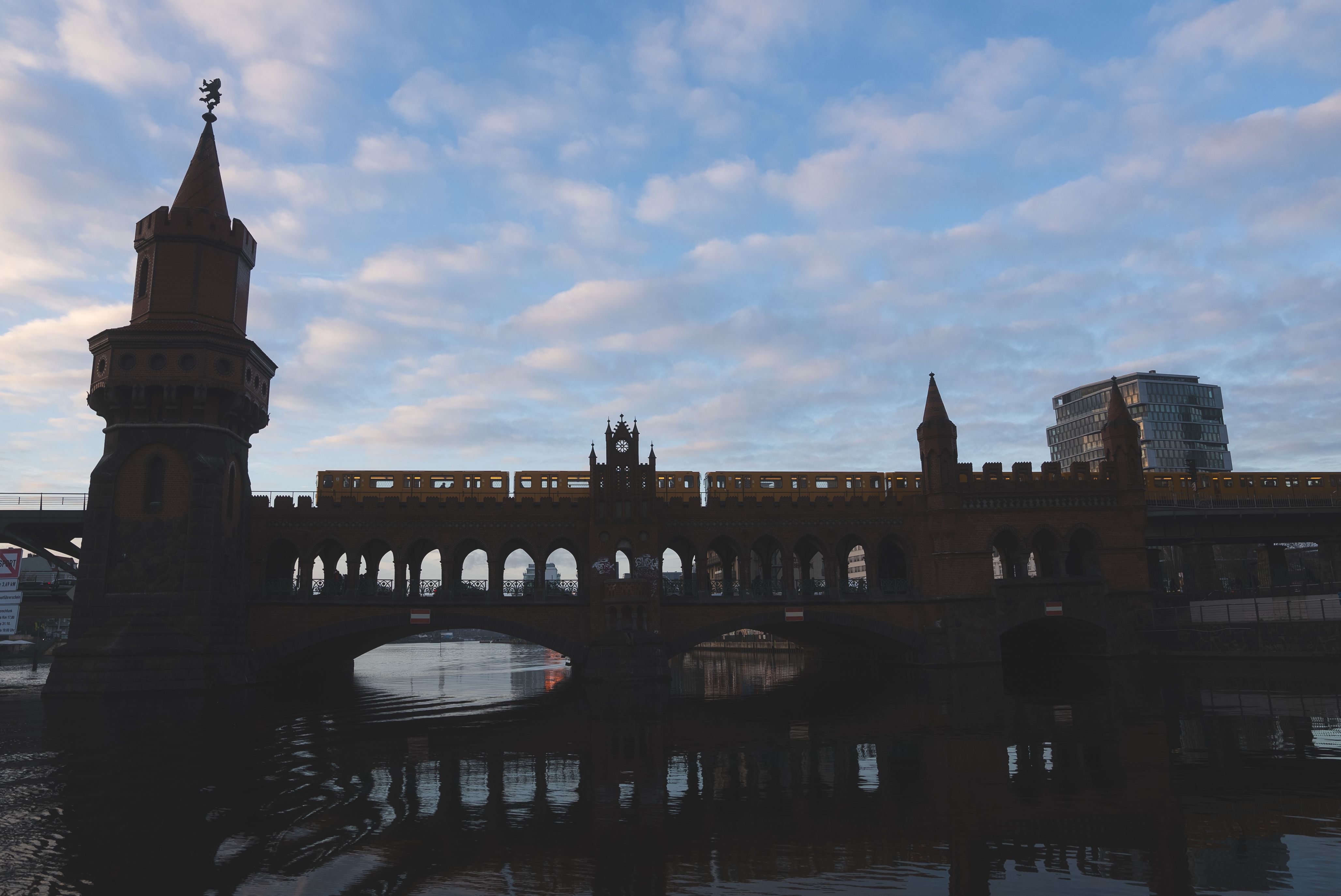 Silhouetted Oberbaum Bridge Crossing the River Spree in Berlin, Germany ...