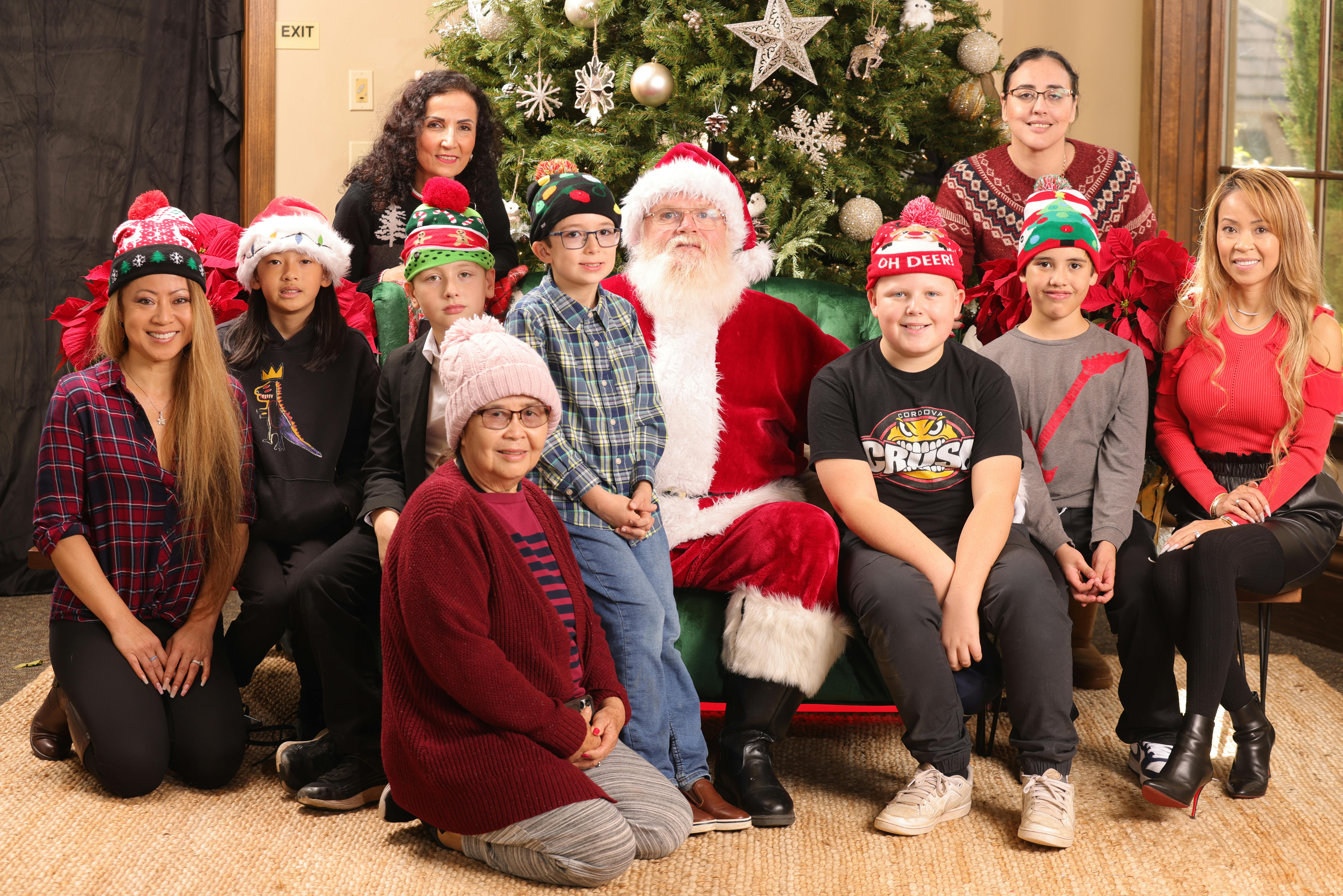 Group of People with a Man in a Santa Claus Costume · Free Stock Photo