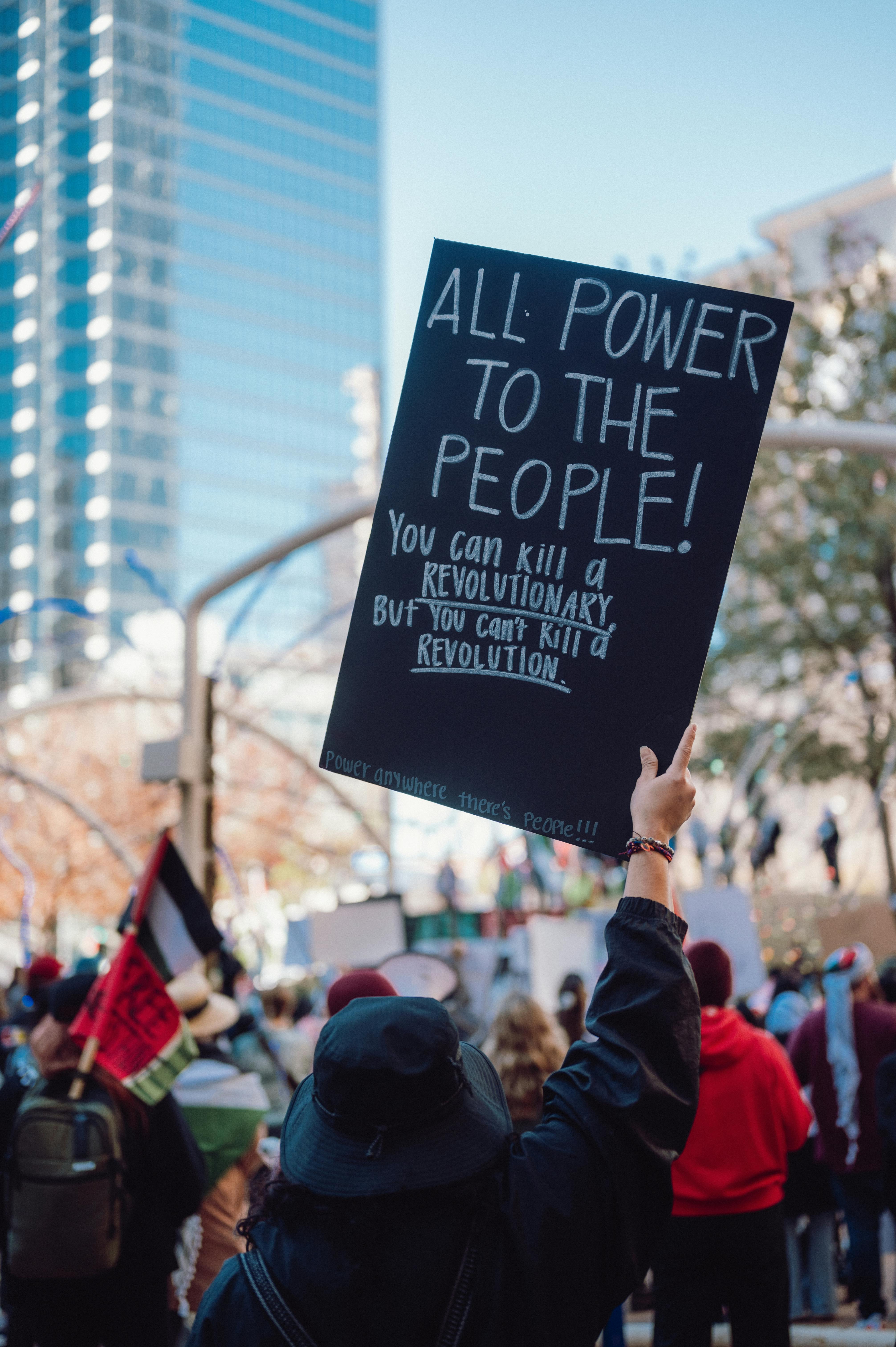 Revolution Slogans on Banner at Protest · Free Stock Photo