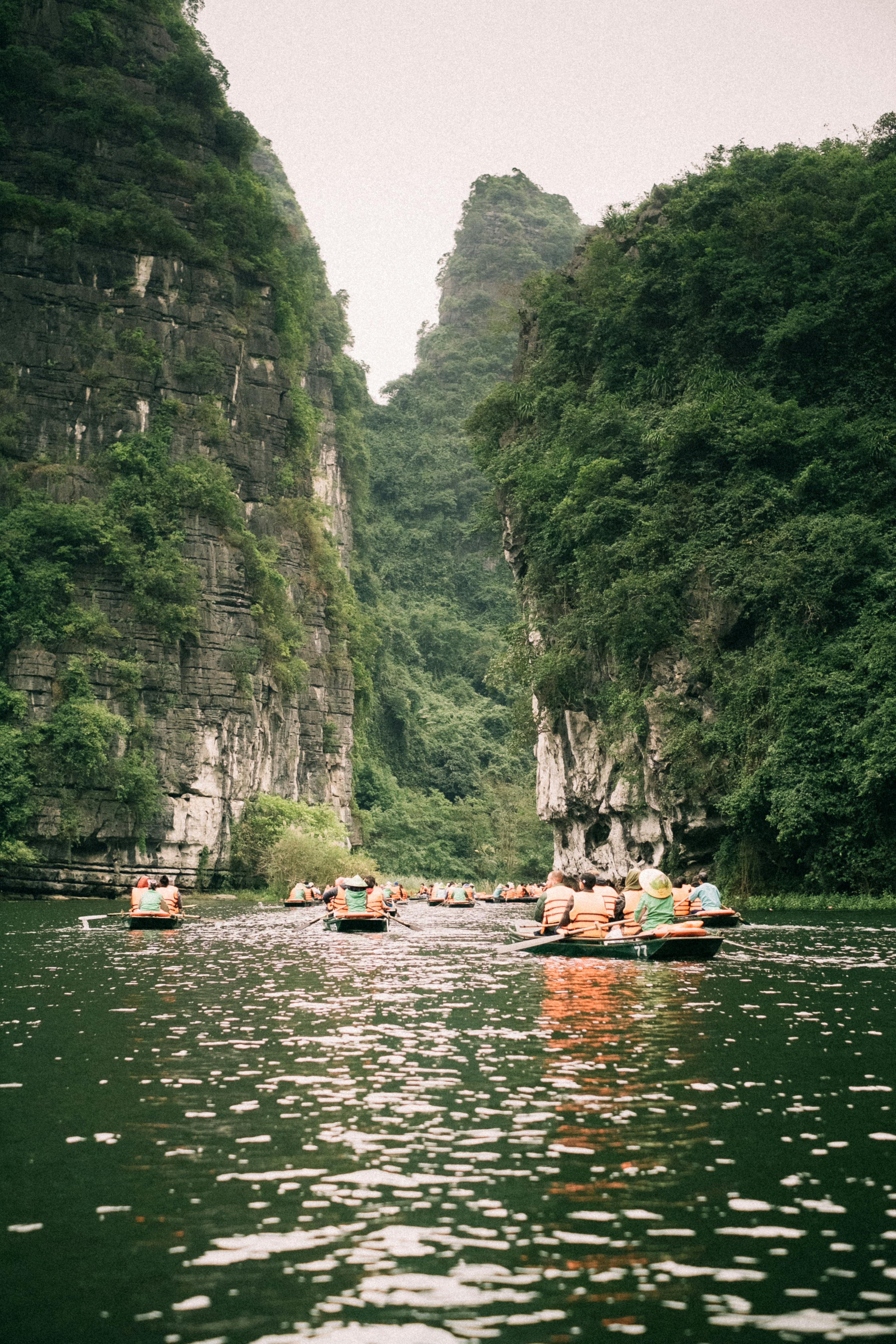 Tourists on Boats on River Between Cliffs · Free Stock Photo