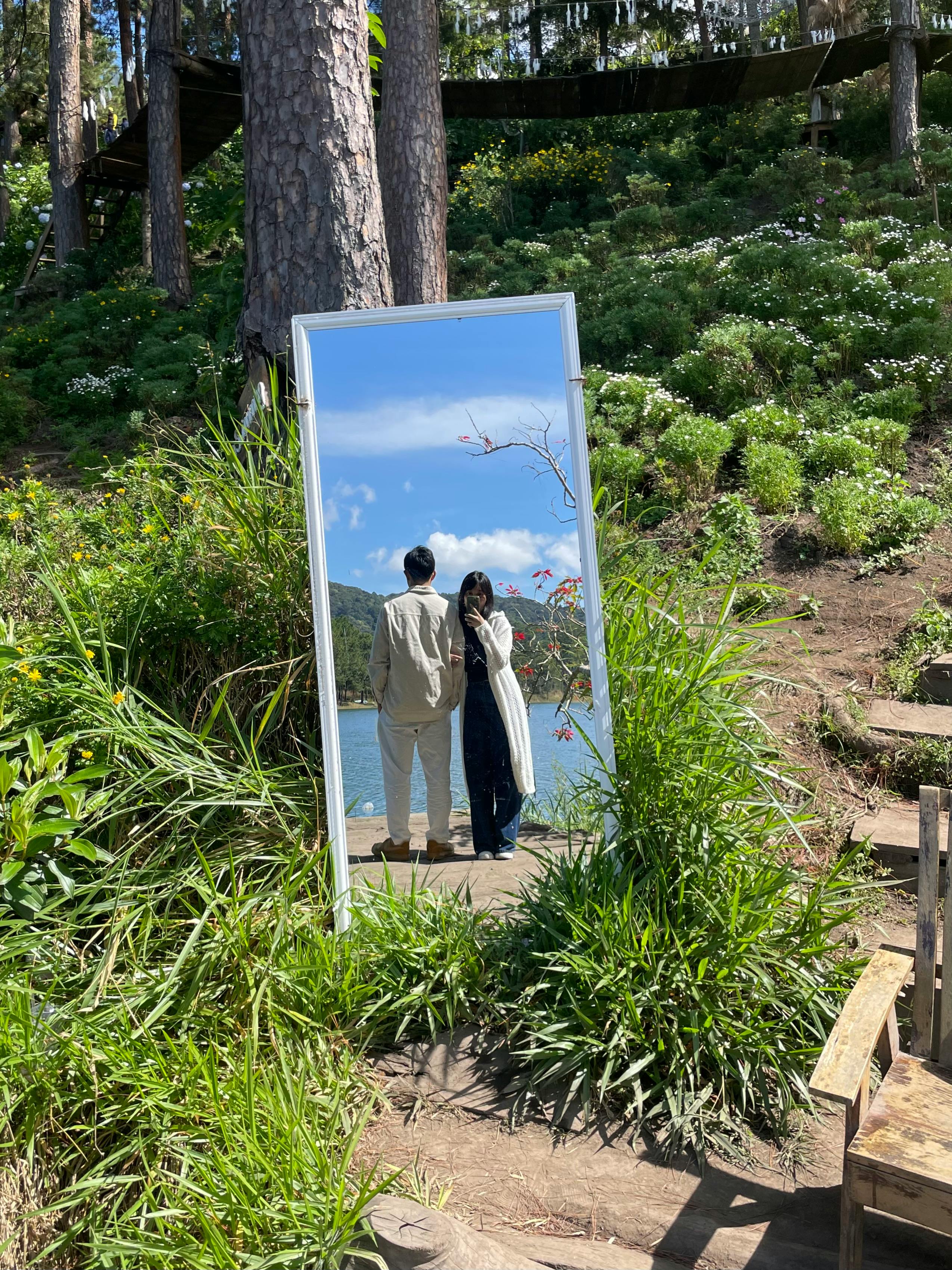 Reflection of a Couple in a Mirror · Free Stock Photo