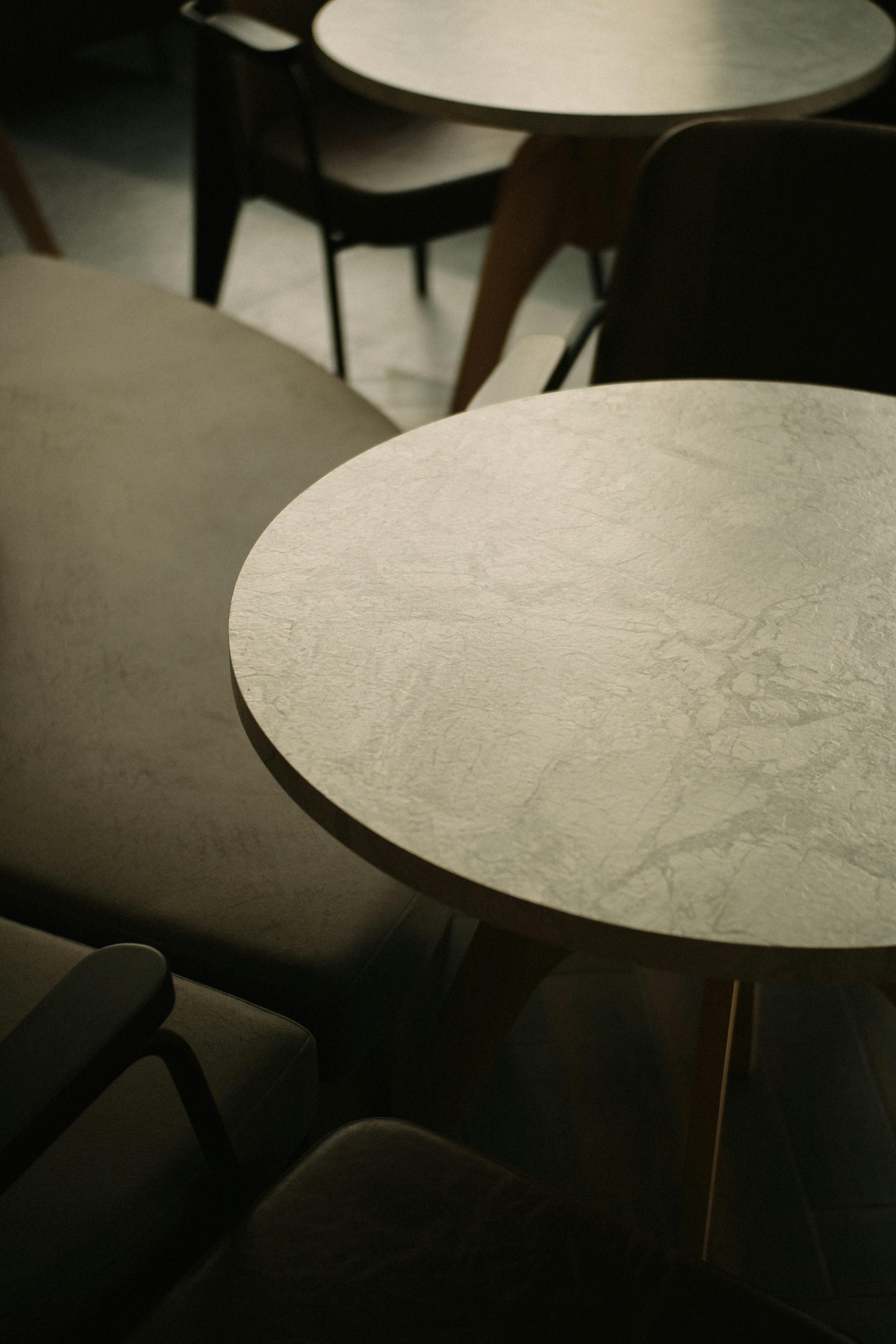 Close-up of Round Coffee Tables and Seats in a Modern Cafe · Free Stock ...
