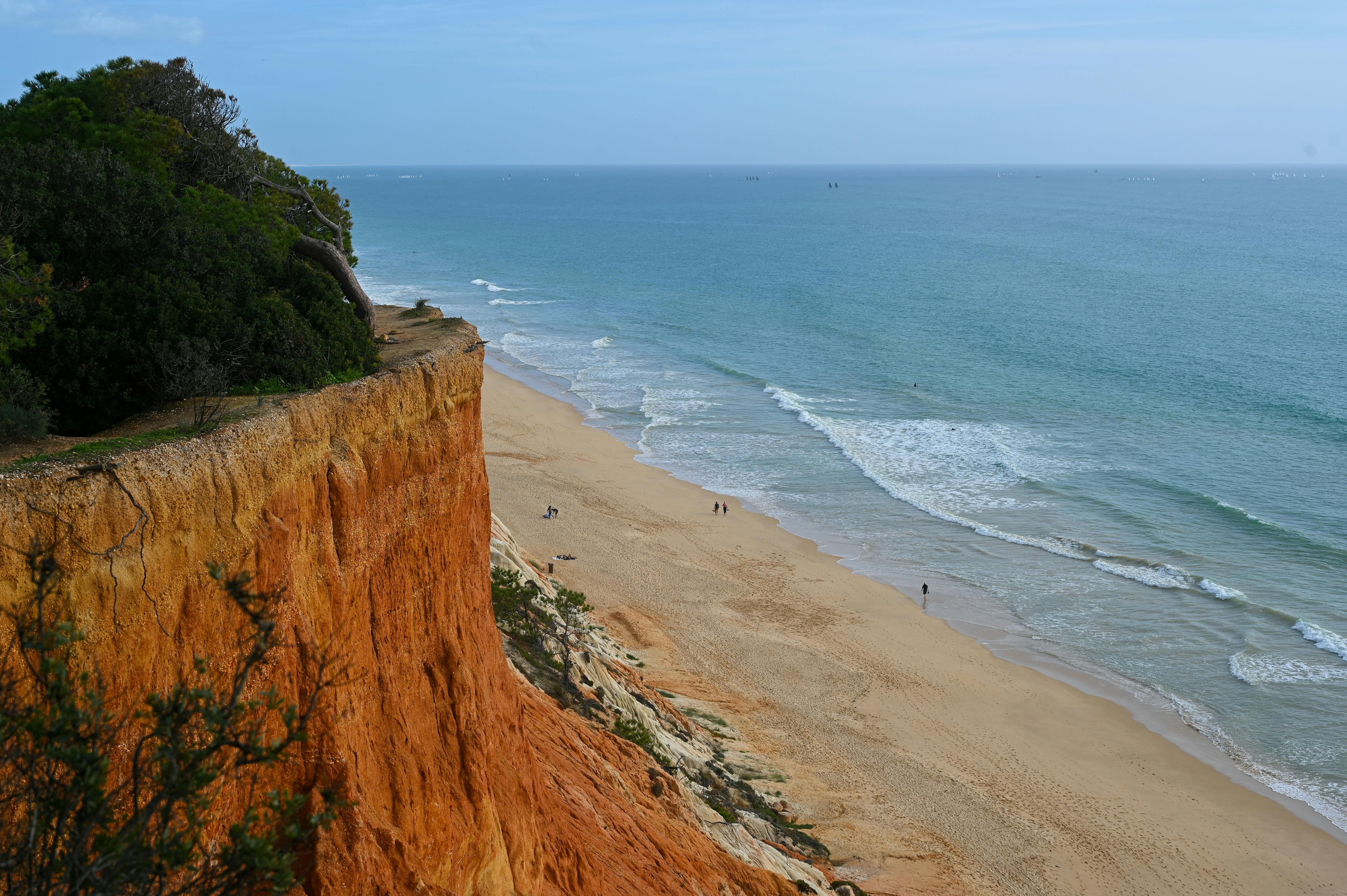 Scenic View of a Cliff and Beach by the Sea · Free Stock Photo