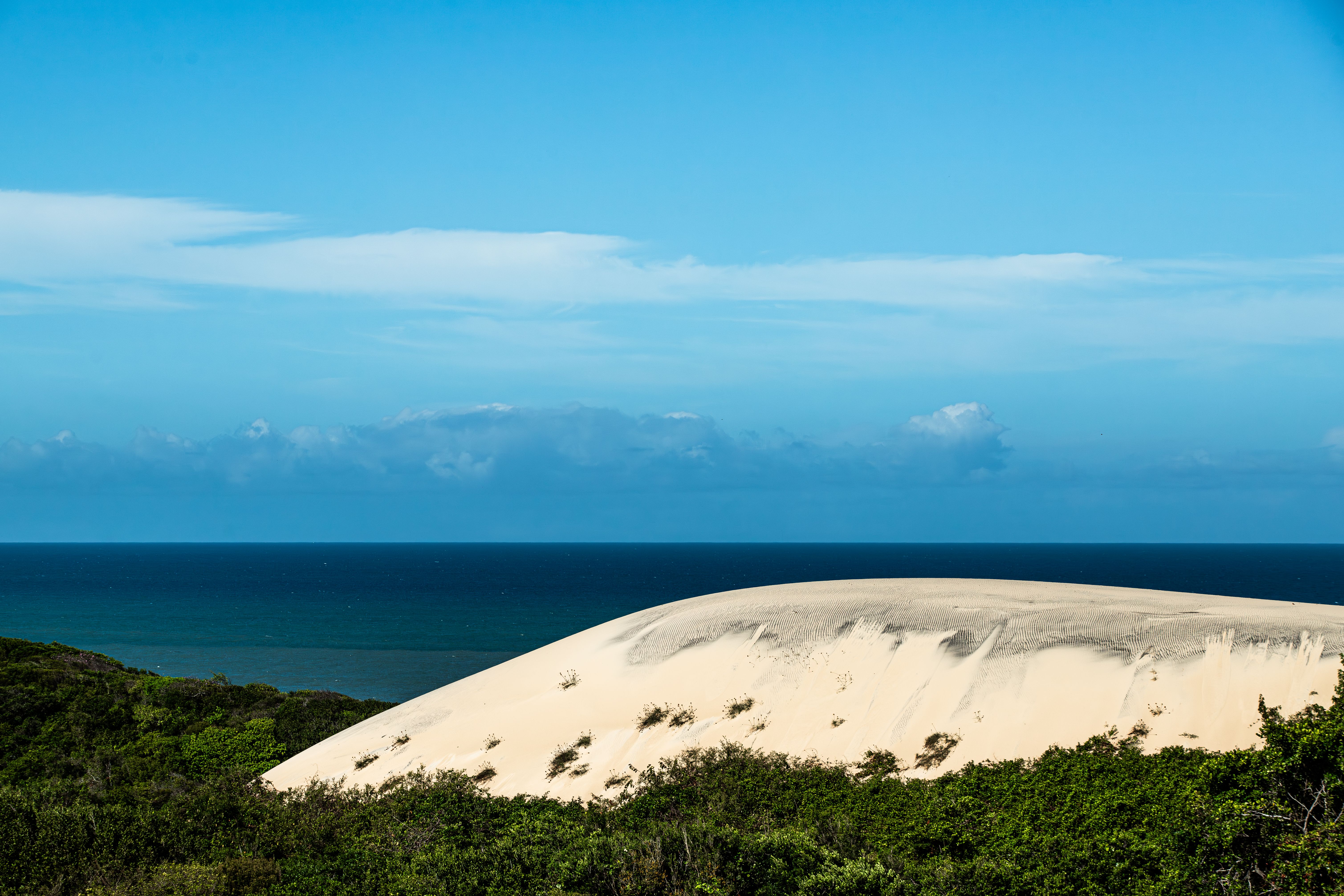 Sandy Hill and Sea in the Distance · Free Stock Photo