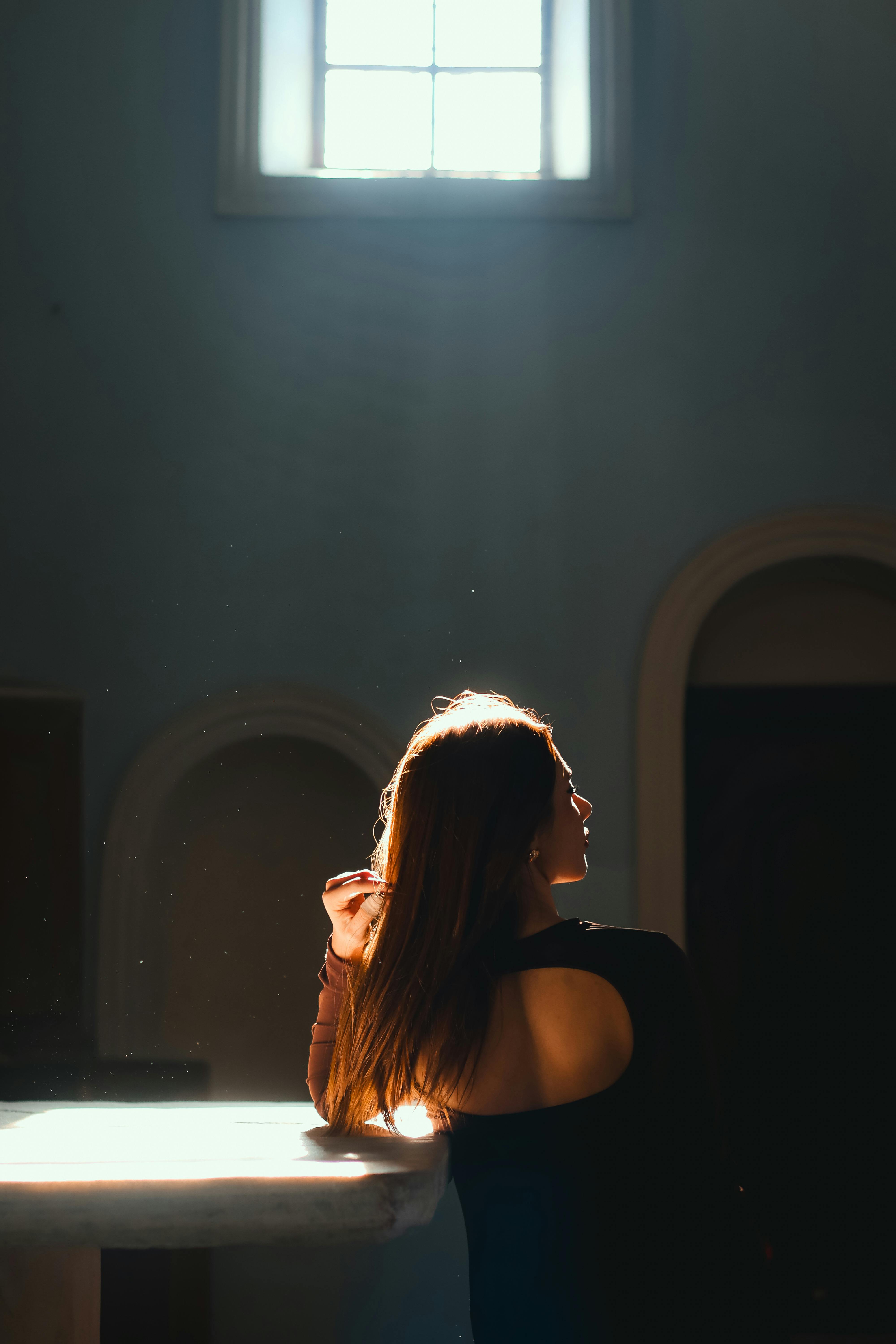 Woman Standing in the Sunlight · Free Stock Photo