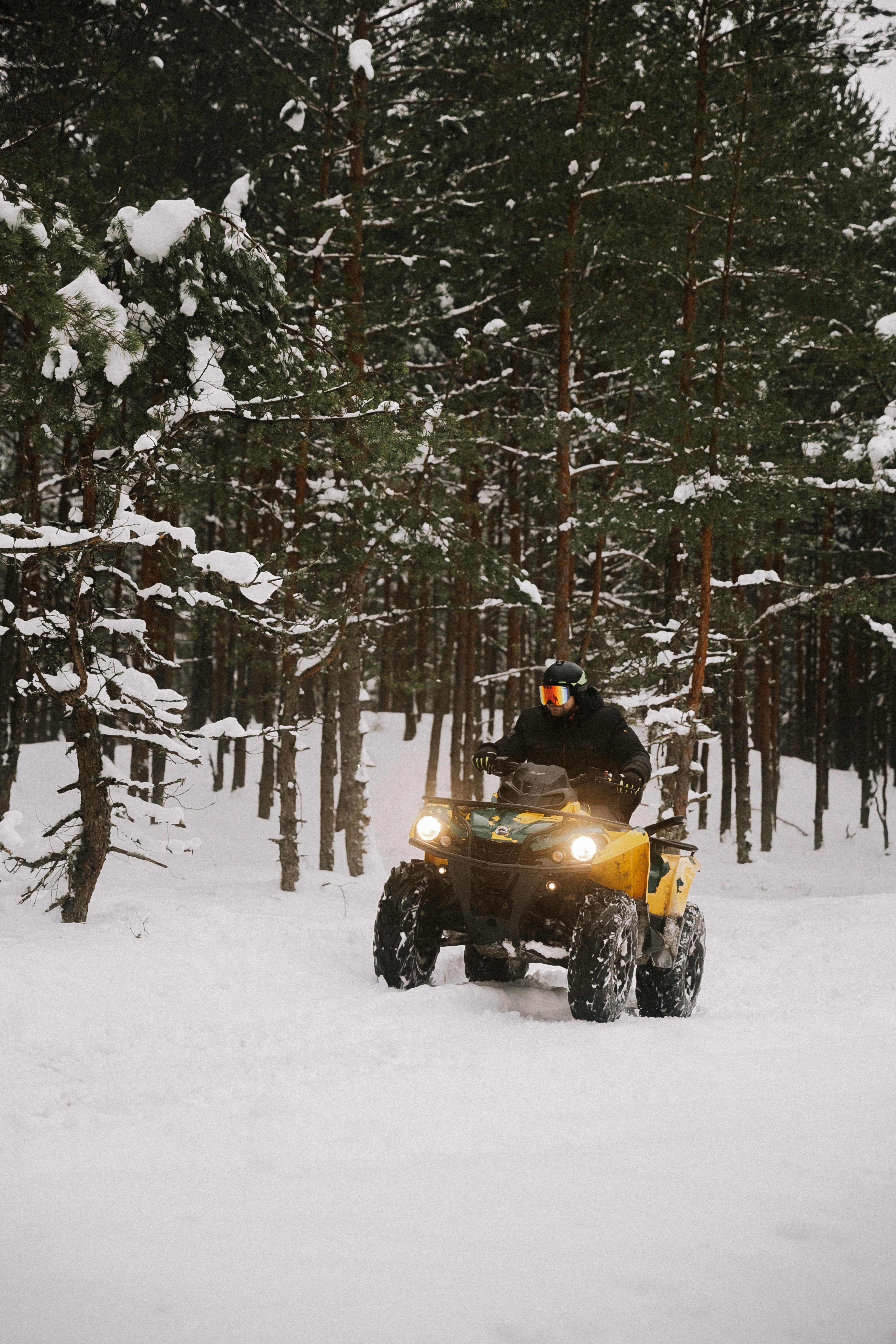 Man Riding a Quad in the Snow · Free Stock Photo