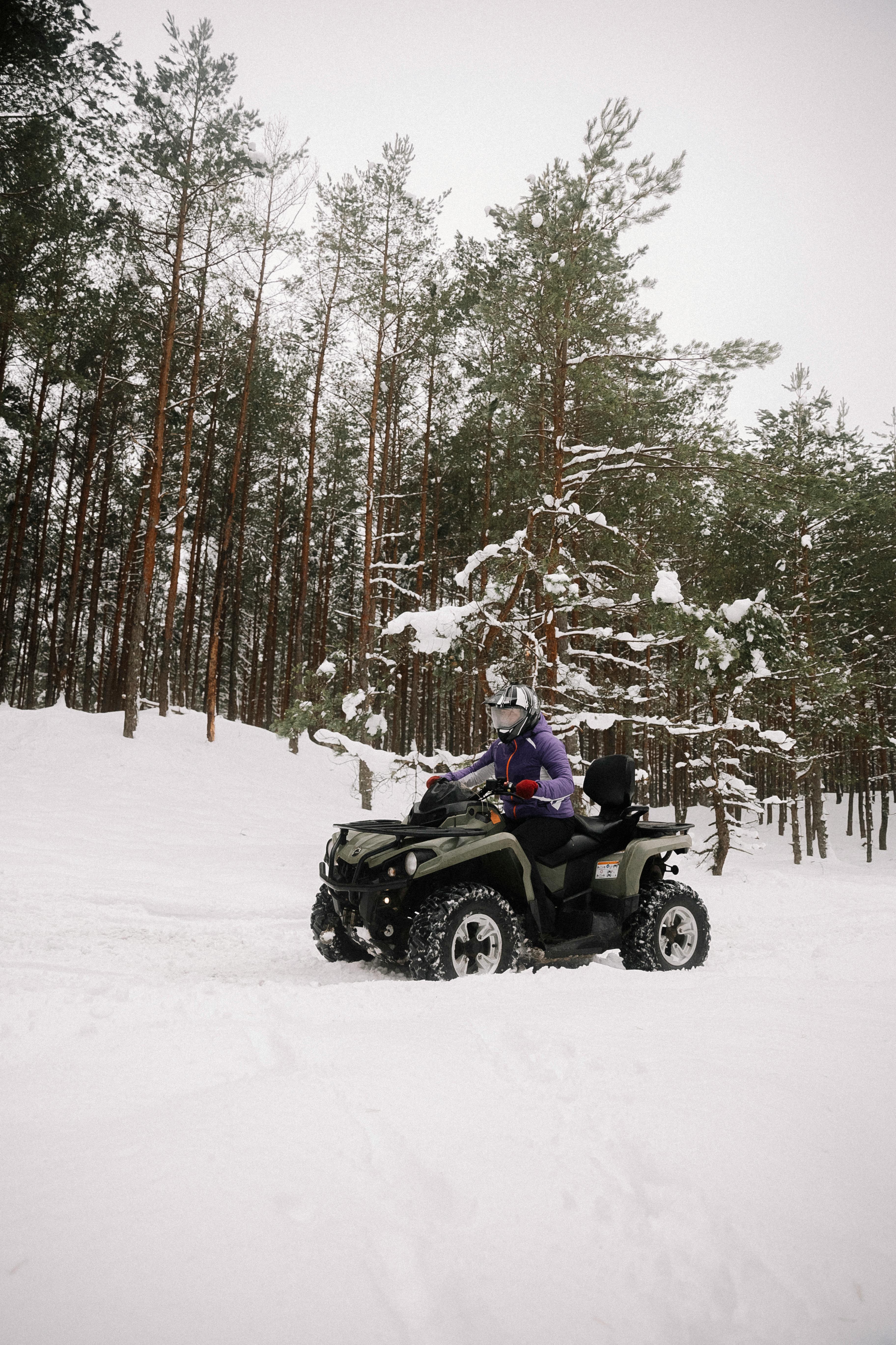 Riding an ATV in Snow · Free Stock Photo