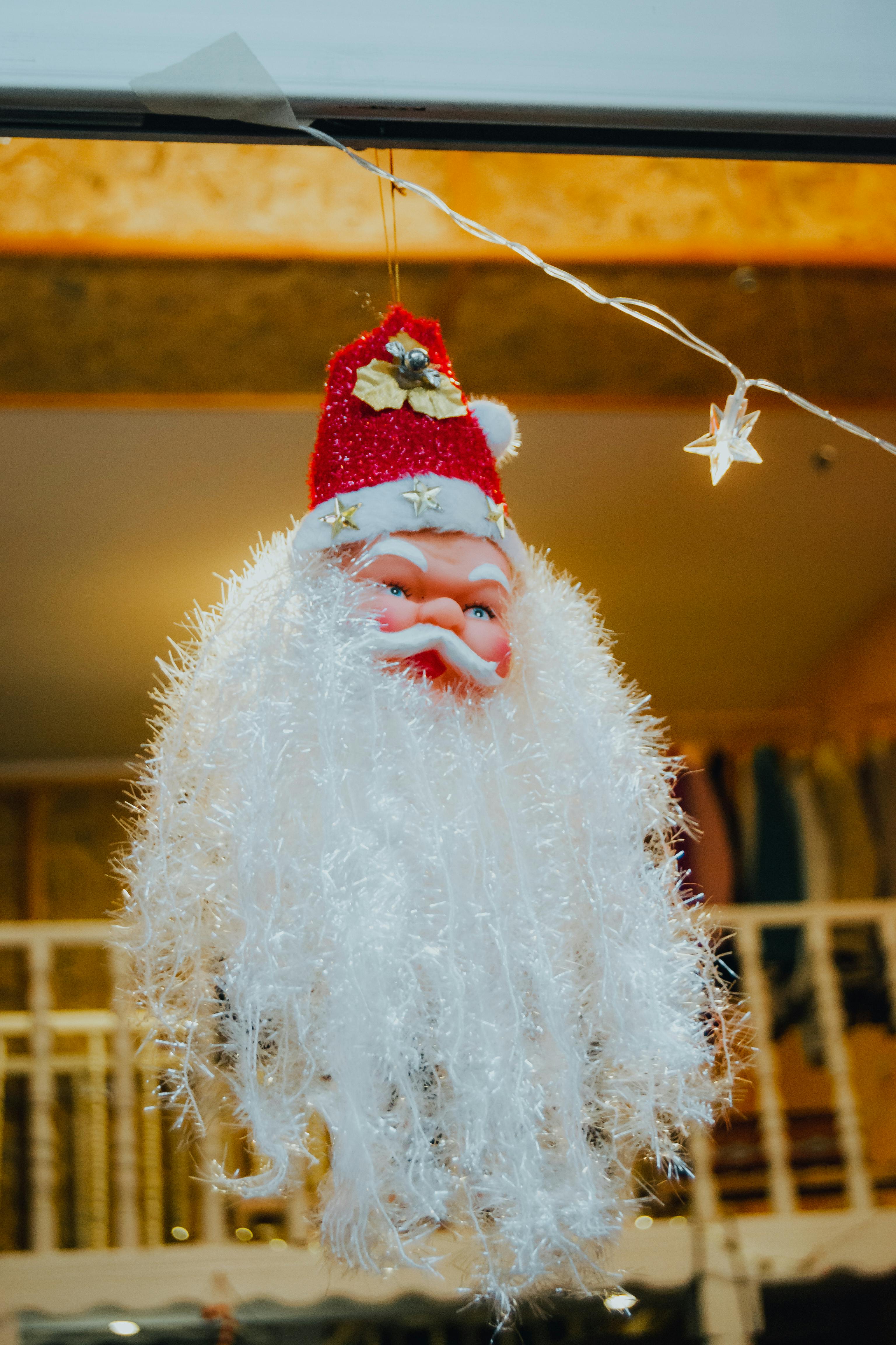 A santa claus hanging from a string · Free Stock Photo