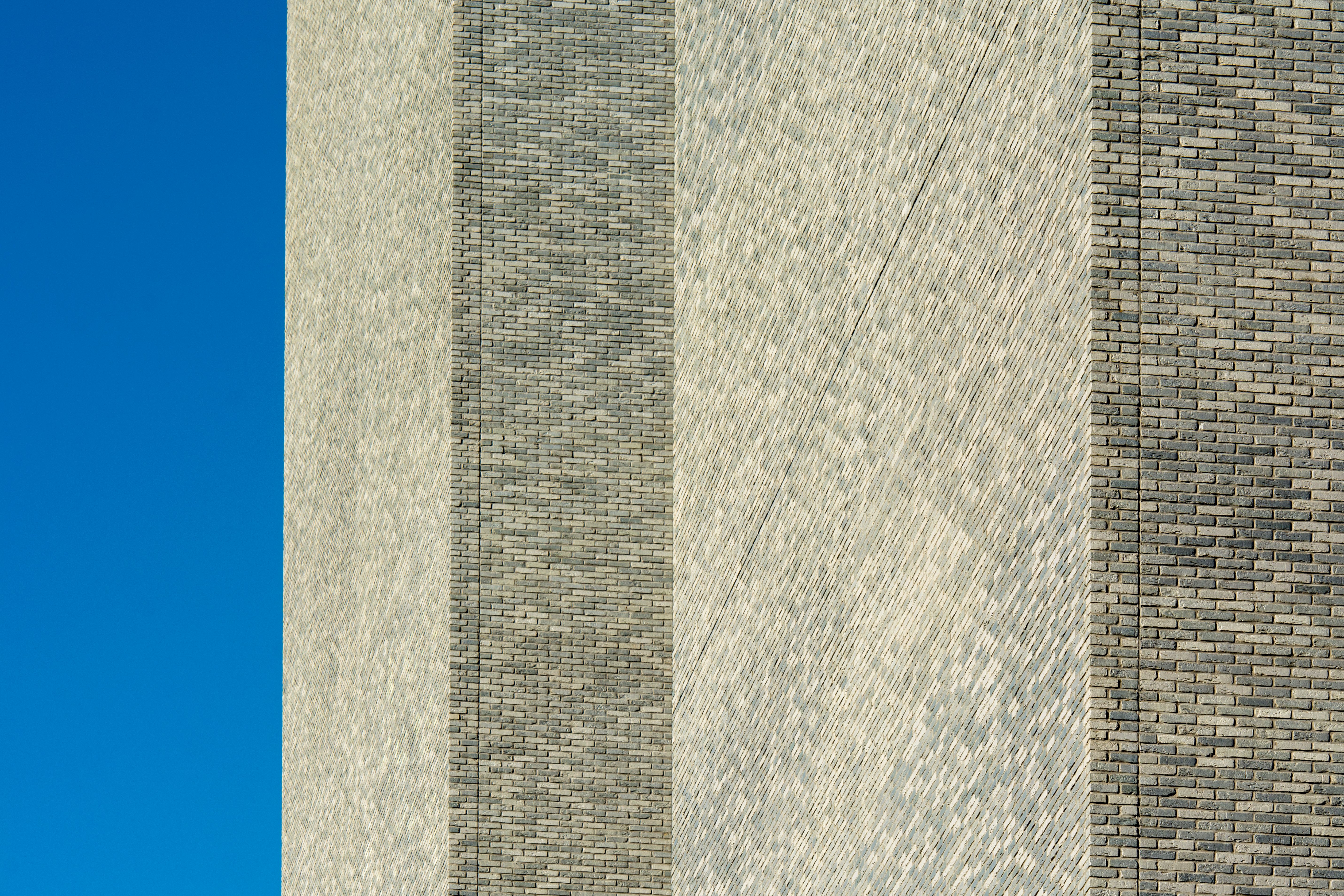 Brick Wall of High Rise Building against Blue Sky · Free Stock Photo