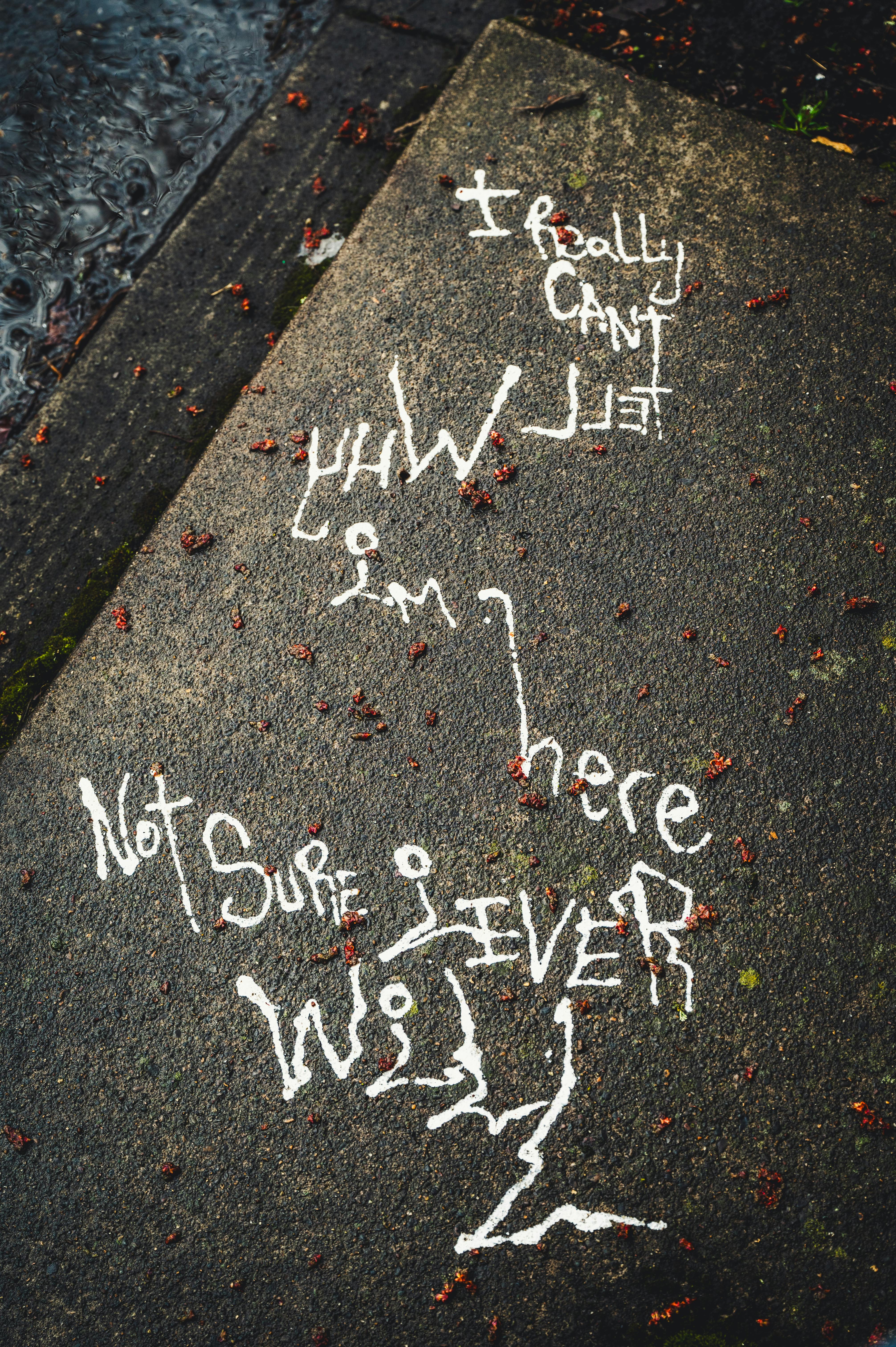 Message on a Wet Pavement · Free Stock Photo