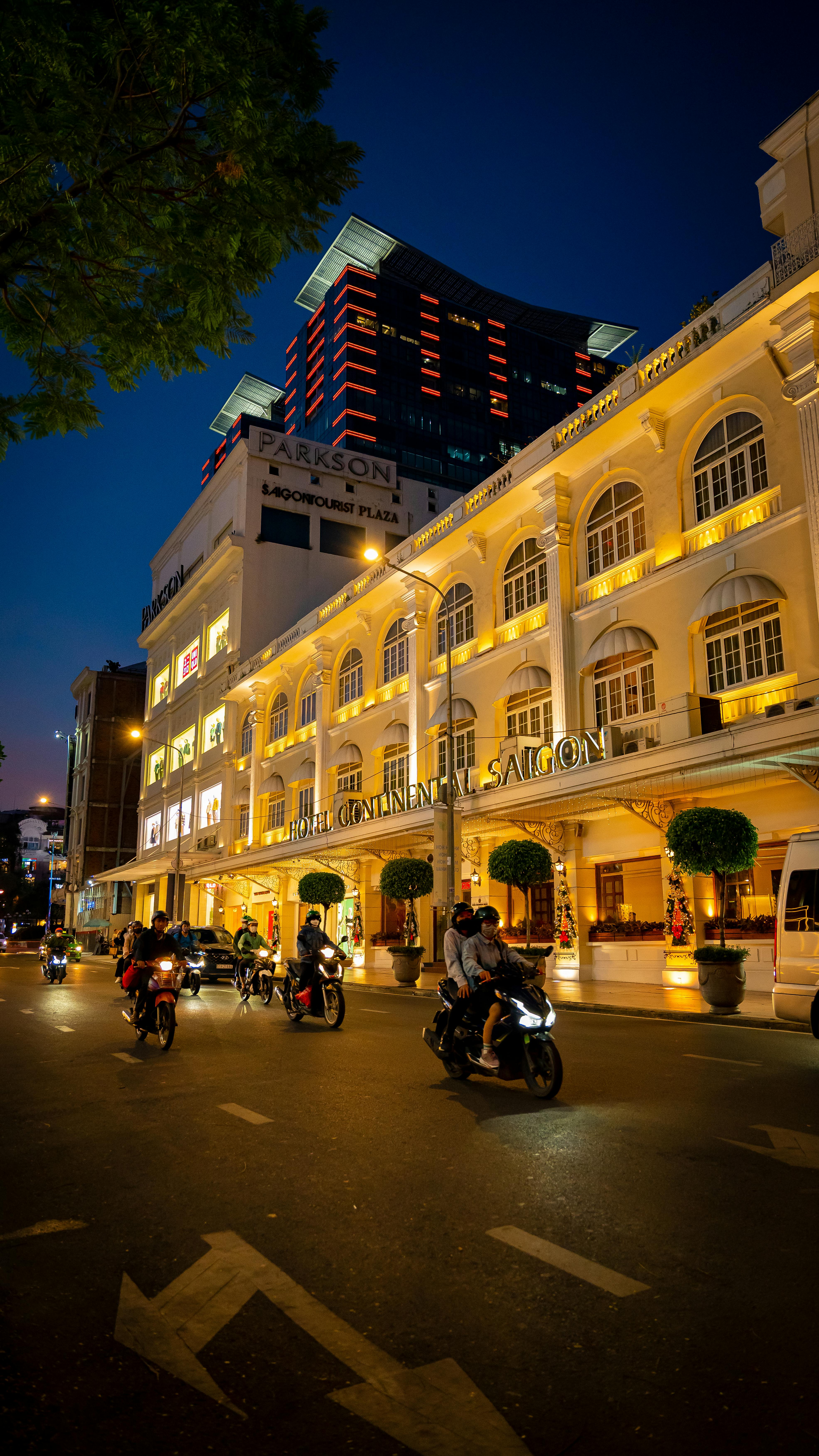 View of Vincom Center Tower behind hotel and street traffic in Saigon ...