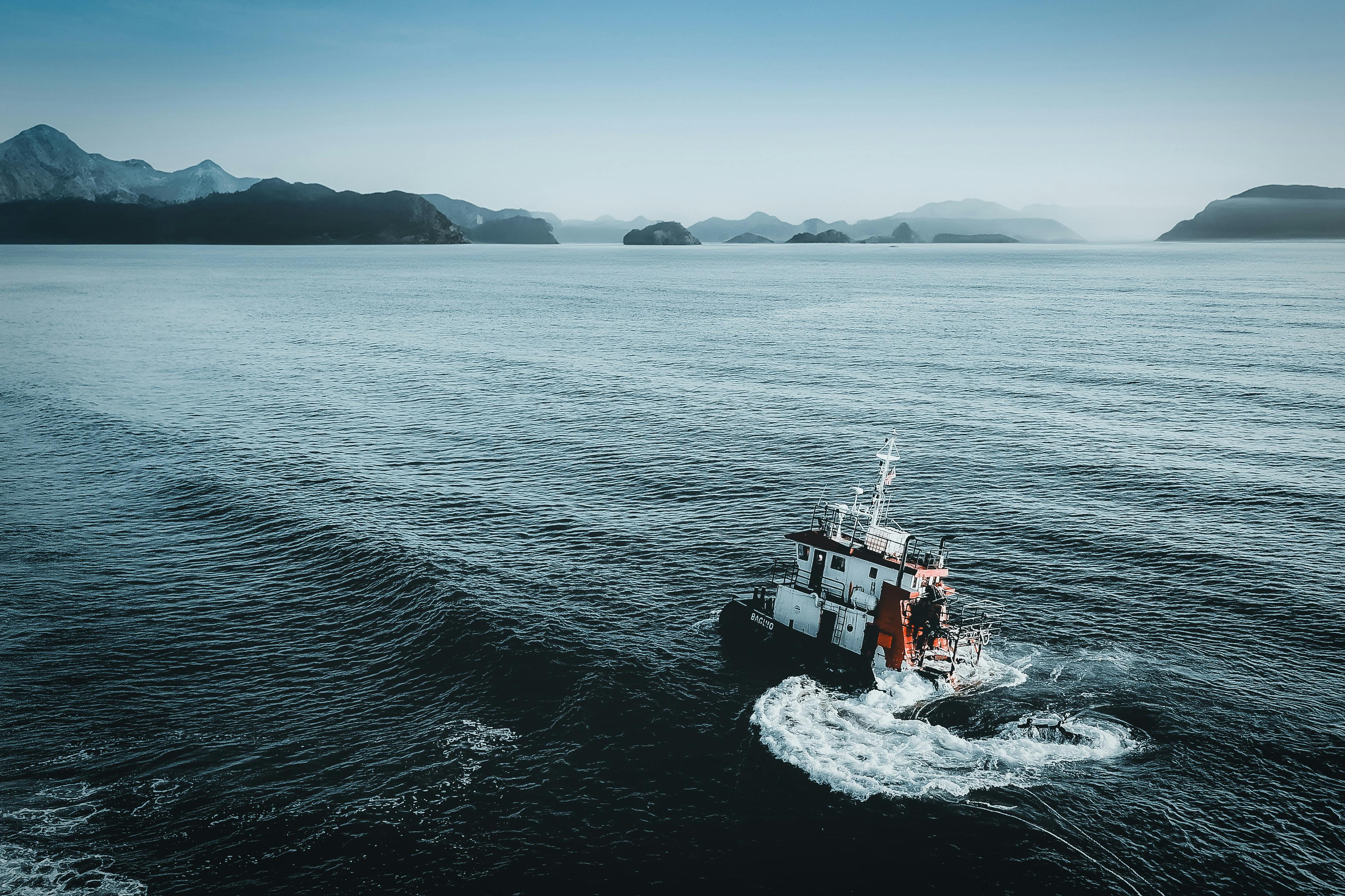 Aerial View of a Half Sunken Boat on the Shore · Free Stock Photo