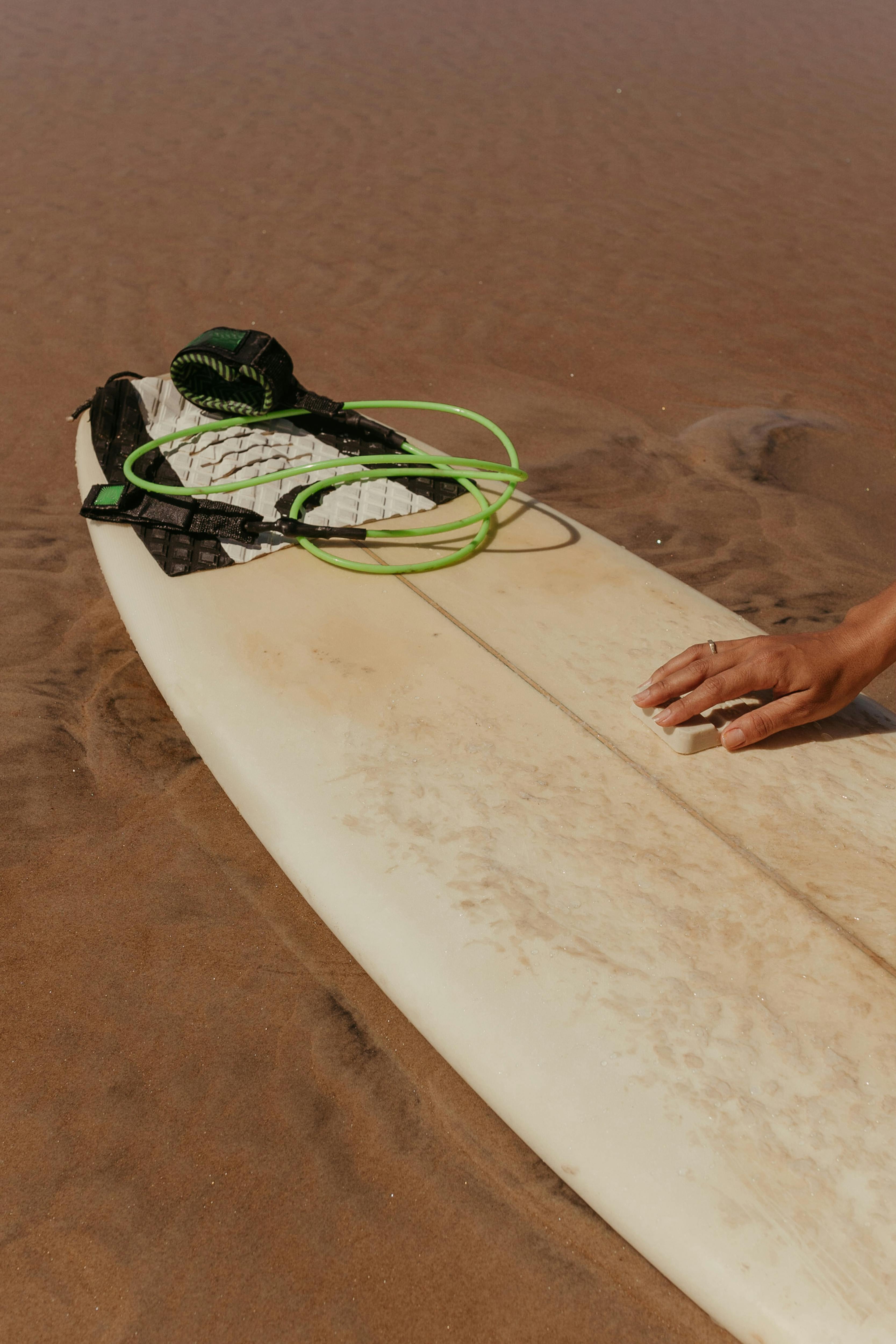 Hand on a Surfboard · Free Stock Photo