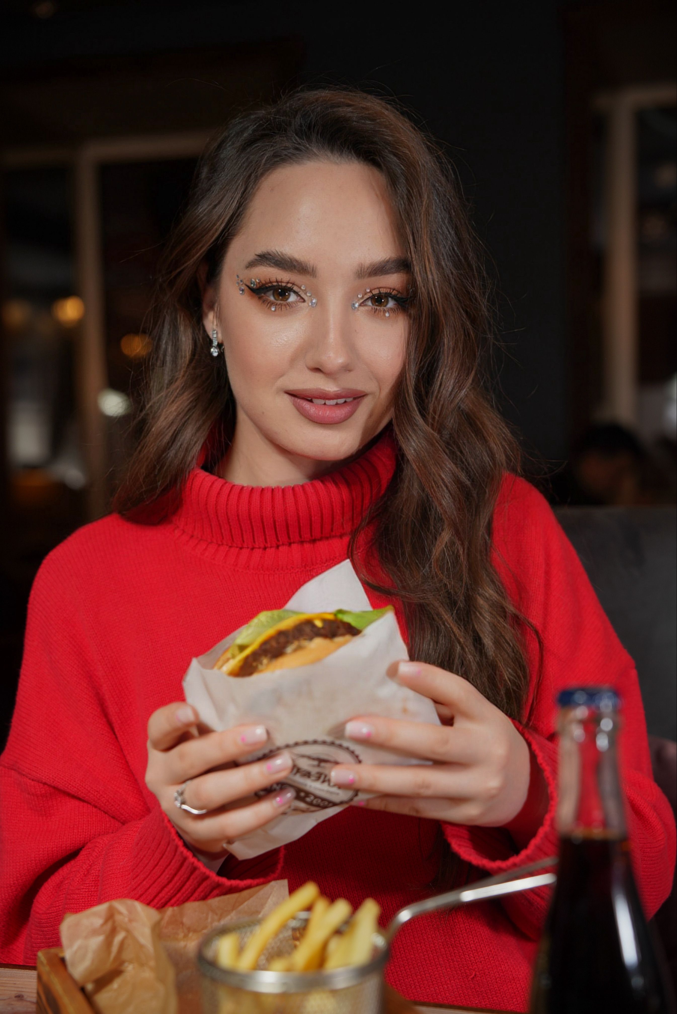 Woman in Red Clothes Sitting with Cheeseburger · Free Stock Photo
