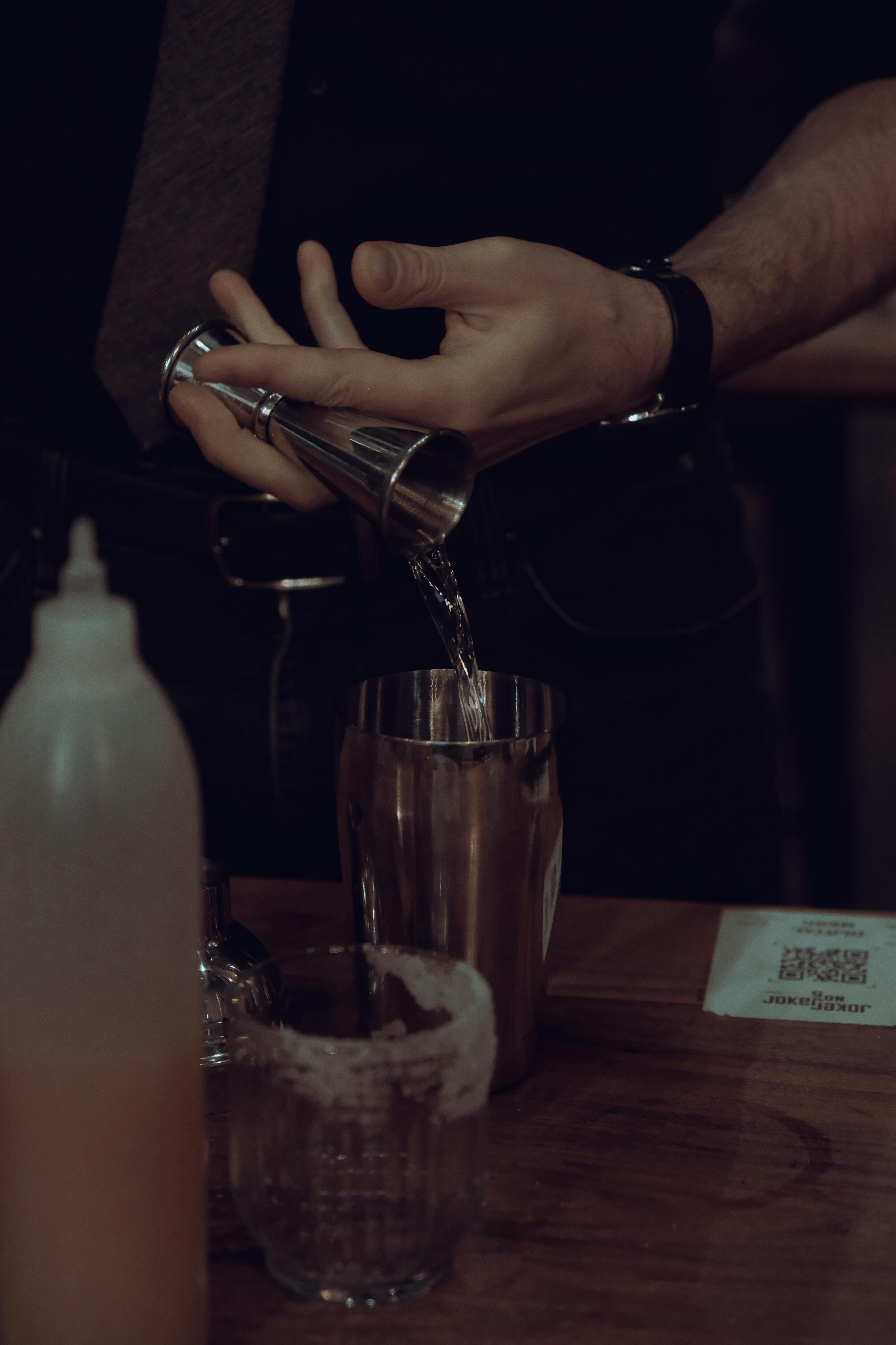 Bartender Mixing Alcohol · Free Stock Photo