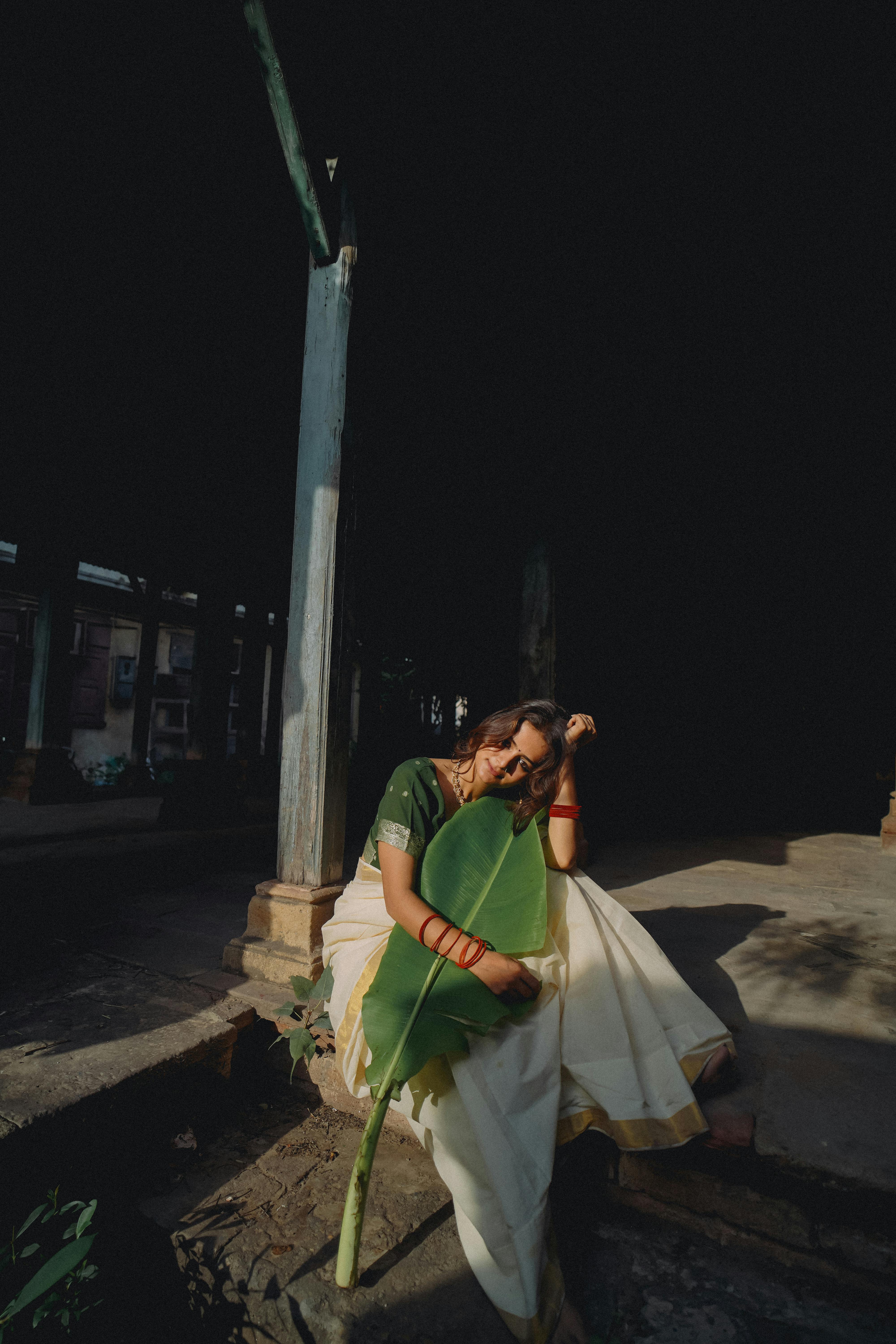 African Woman in Traditional Clothing Sitting and Holding a Calabash ...