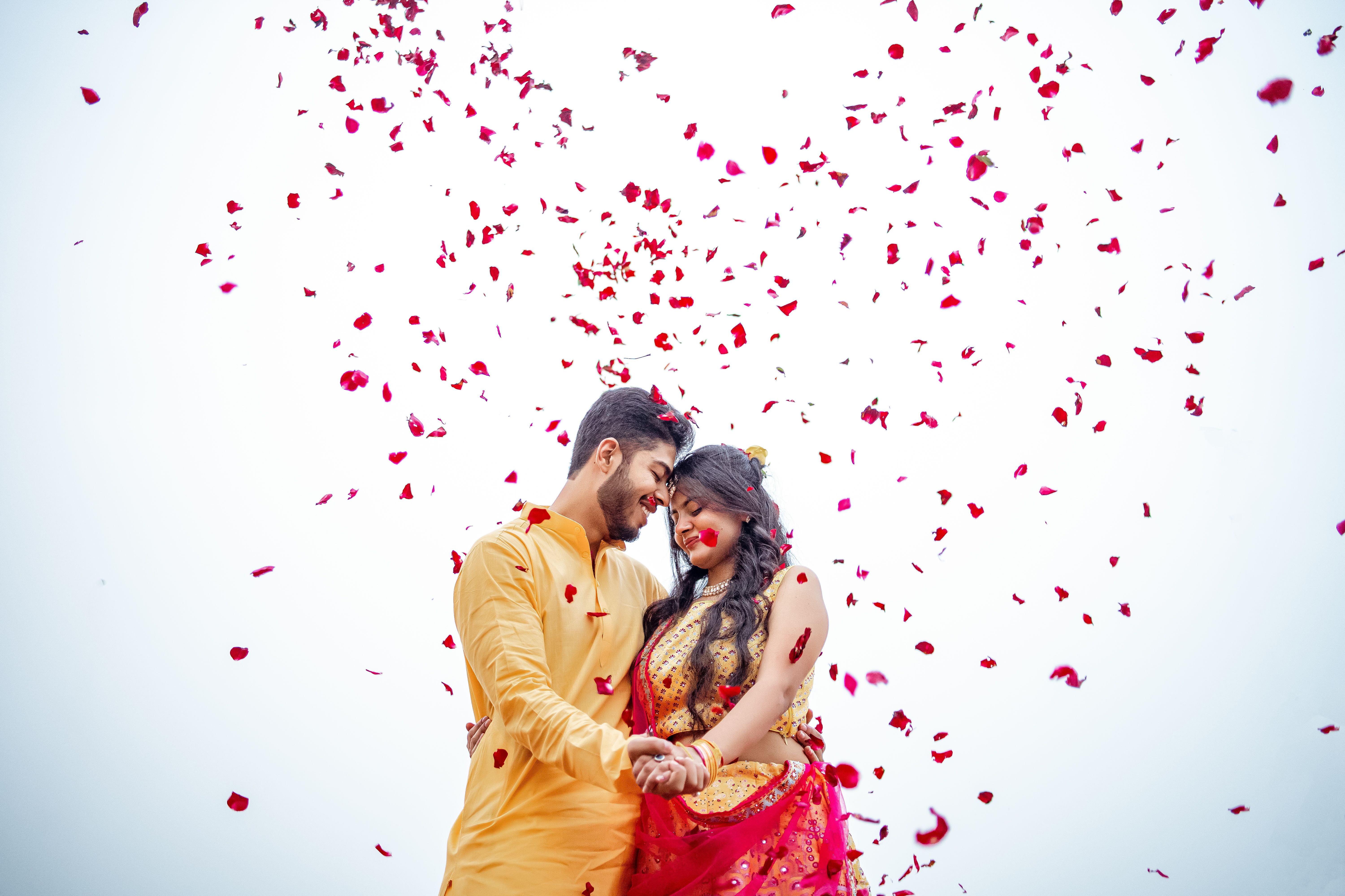 Couple Standing amid Rose Petals · Free Stock Photo