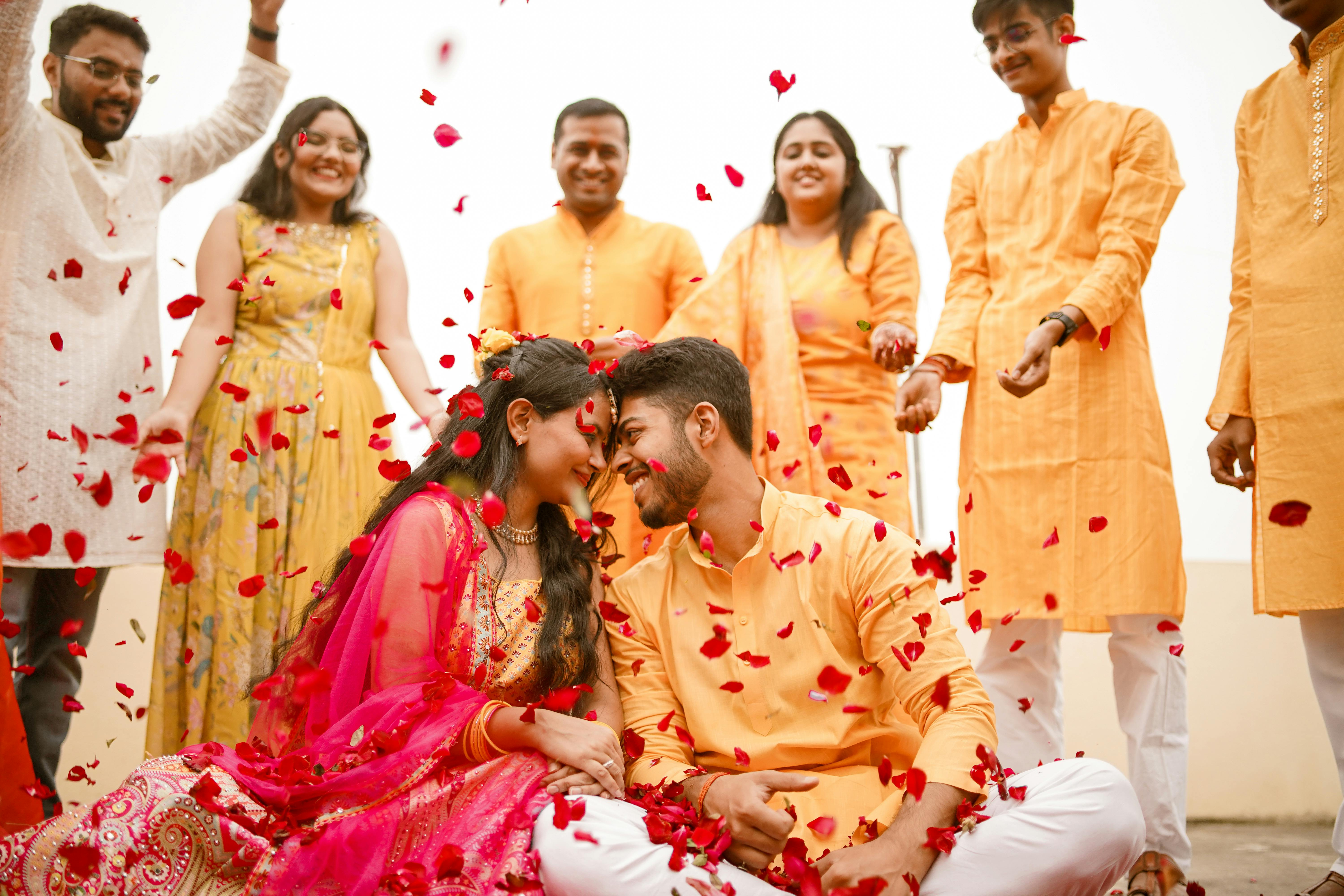 People Throwing Flower Petals on a Newlywed Couple · Free Stock Photo