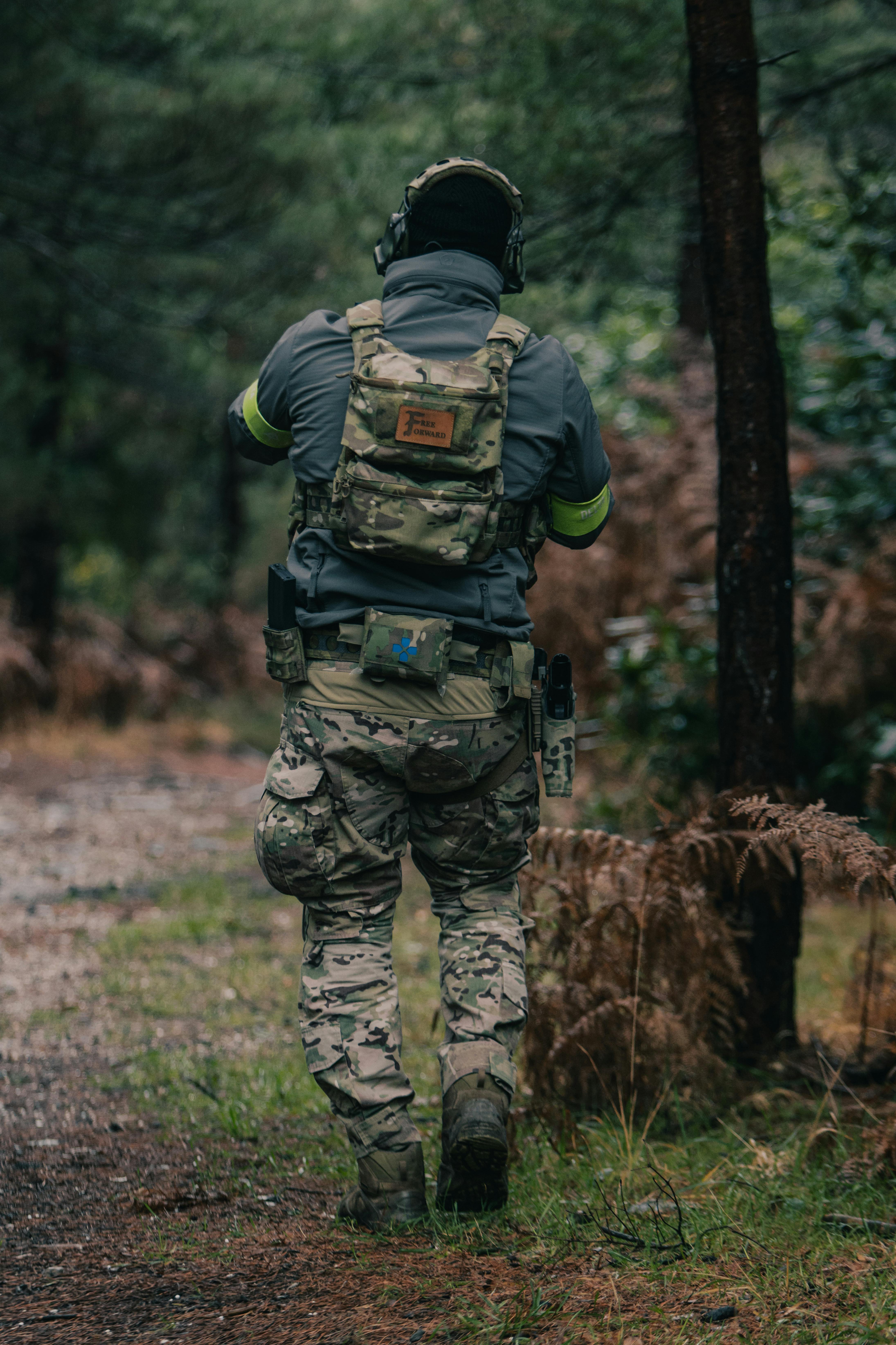 Man in Military Uniform in Forest · Free Stock Photo