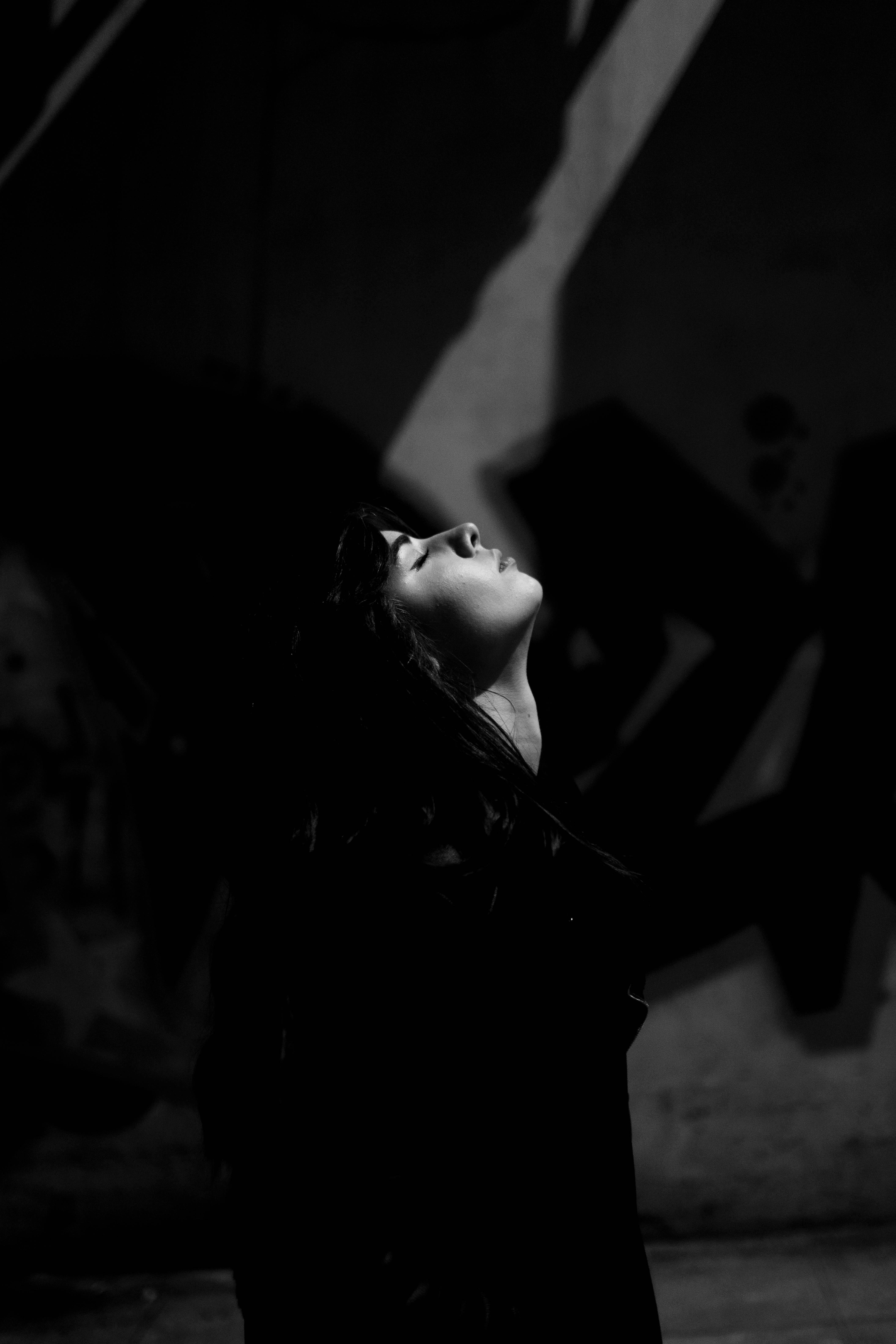 Black and White Photography of a Woman Standing with her Face Turned ...