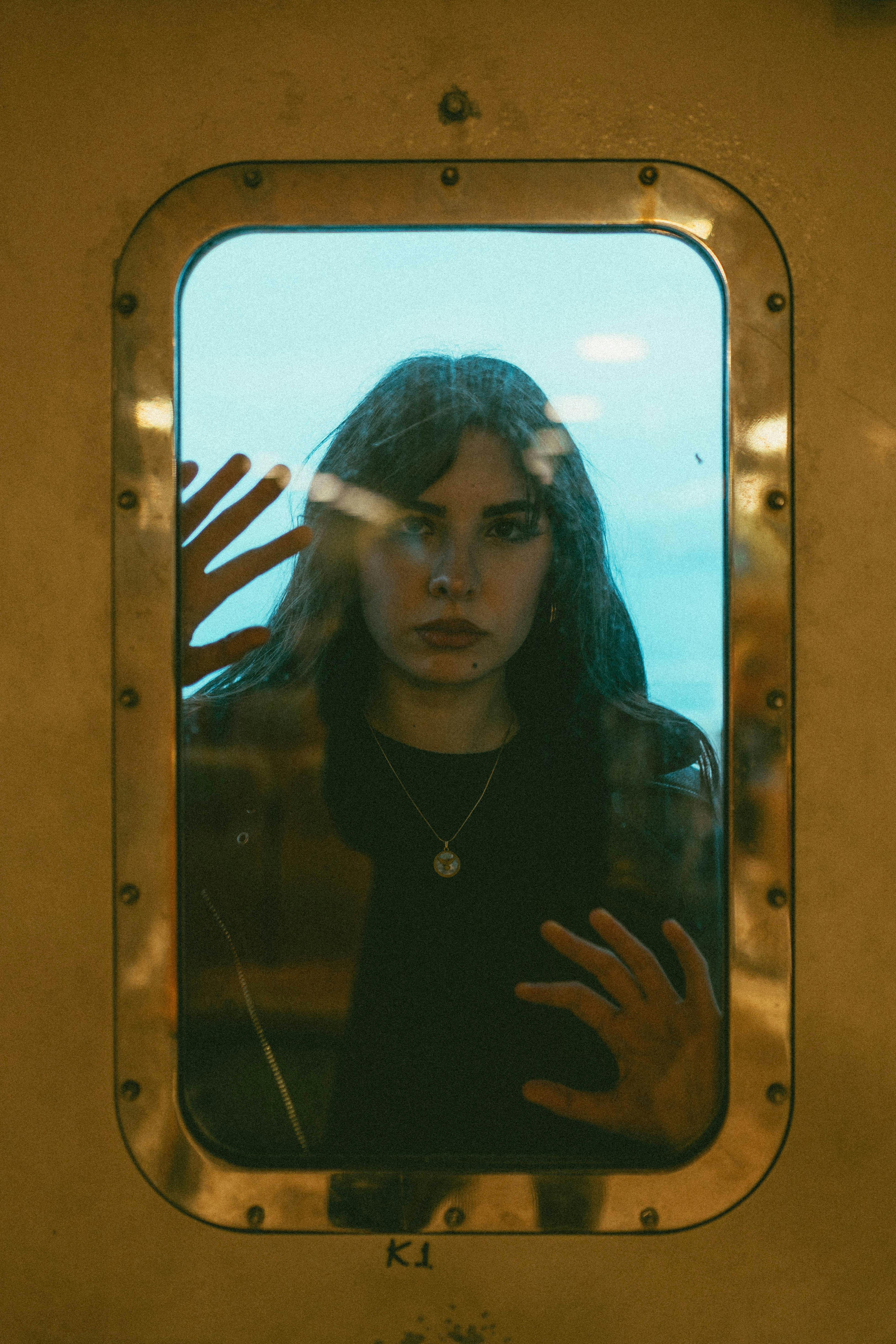 Woman Standing in the Train Window · Free Stock Photo