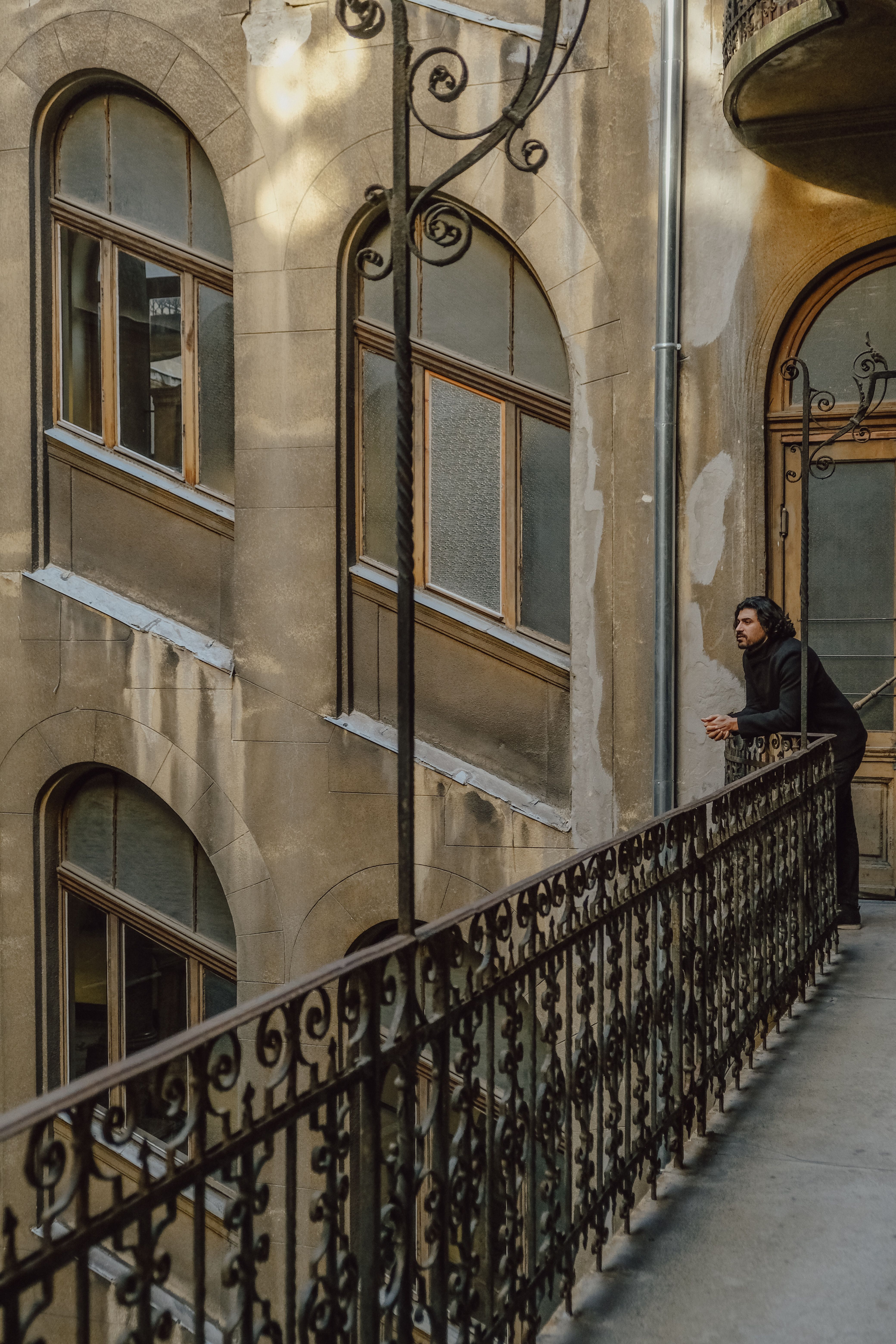Man Standing on the Balcony · Free Stock Photo