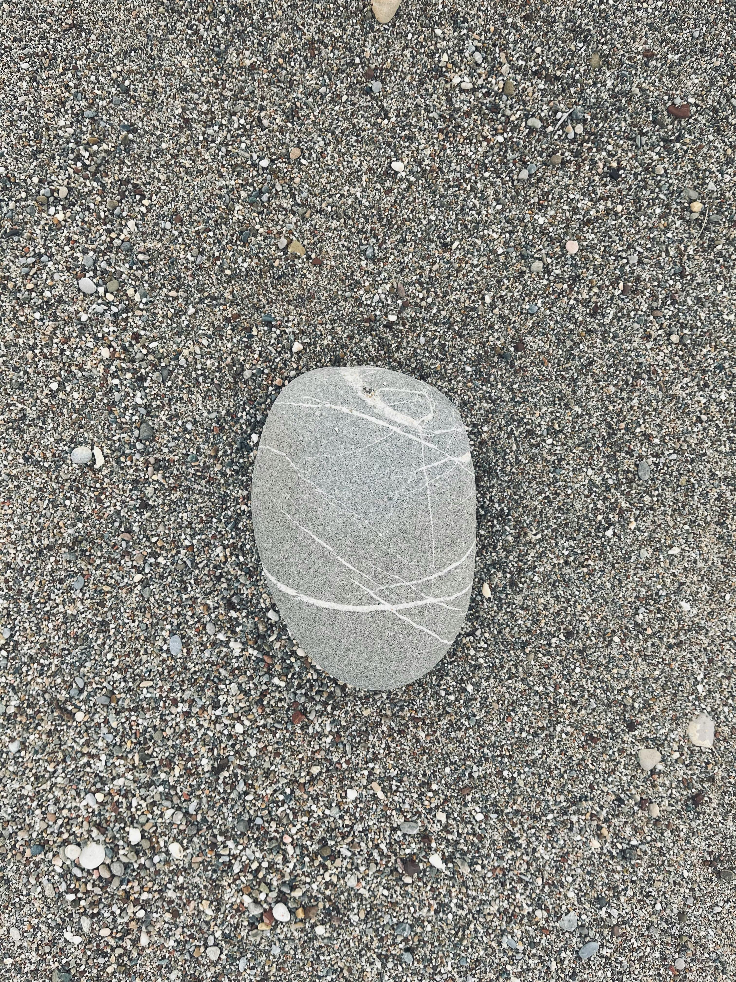 Grey Rock Laying on Sand · Free Stock Photo