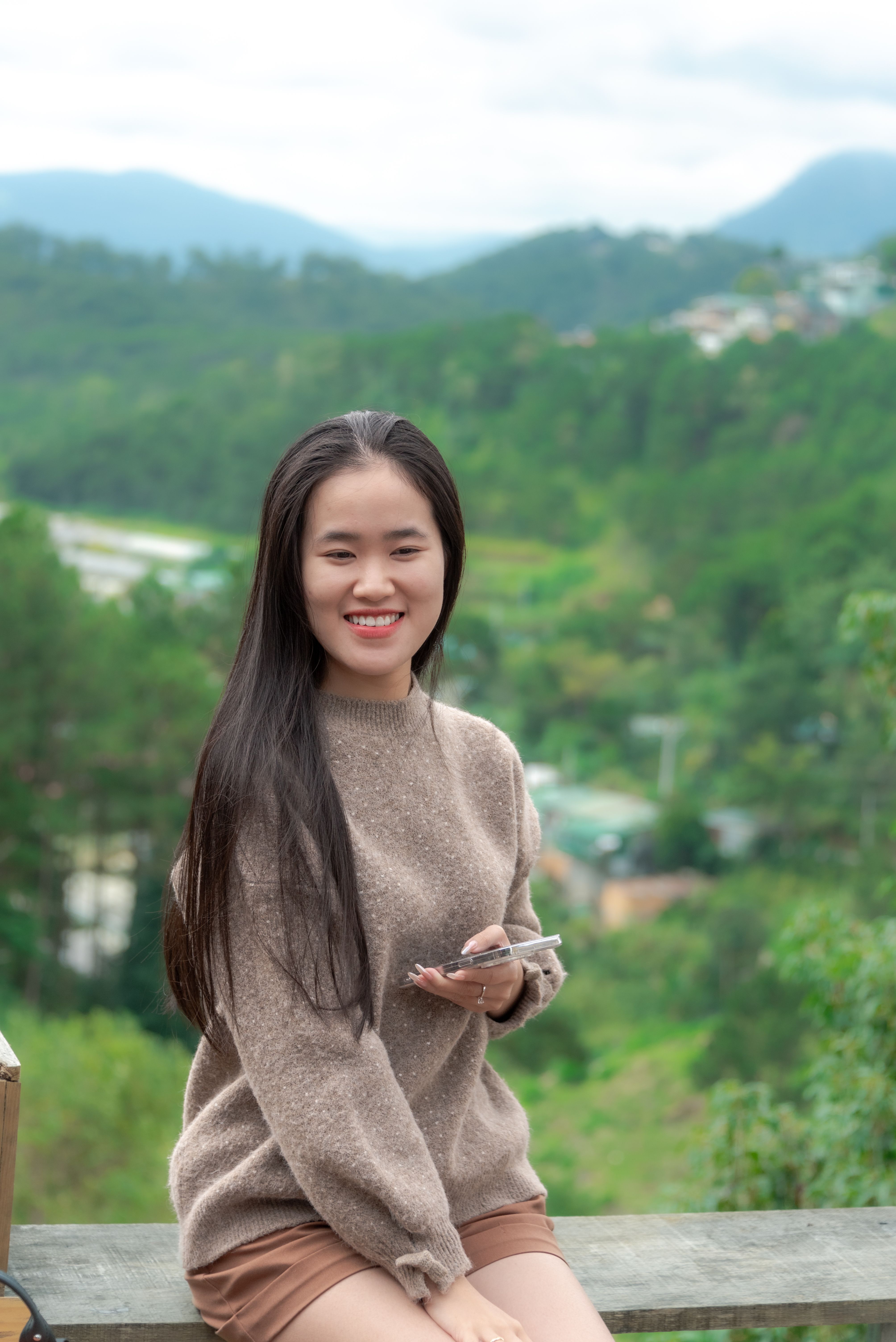 Brunette Woman Sitting in a Valley · Free Stock Photo